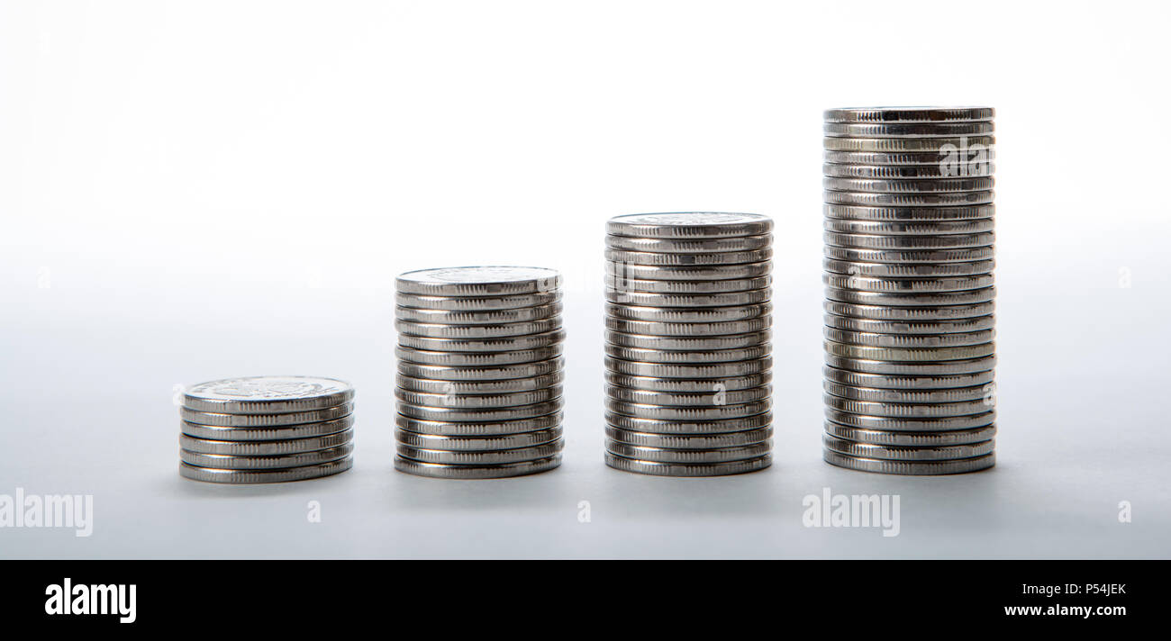 stacks of coins on a white background close up Stock Photo - Alamy