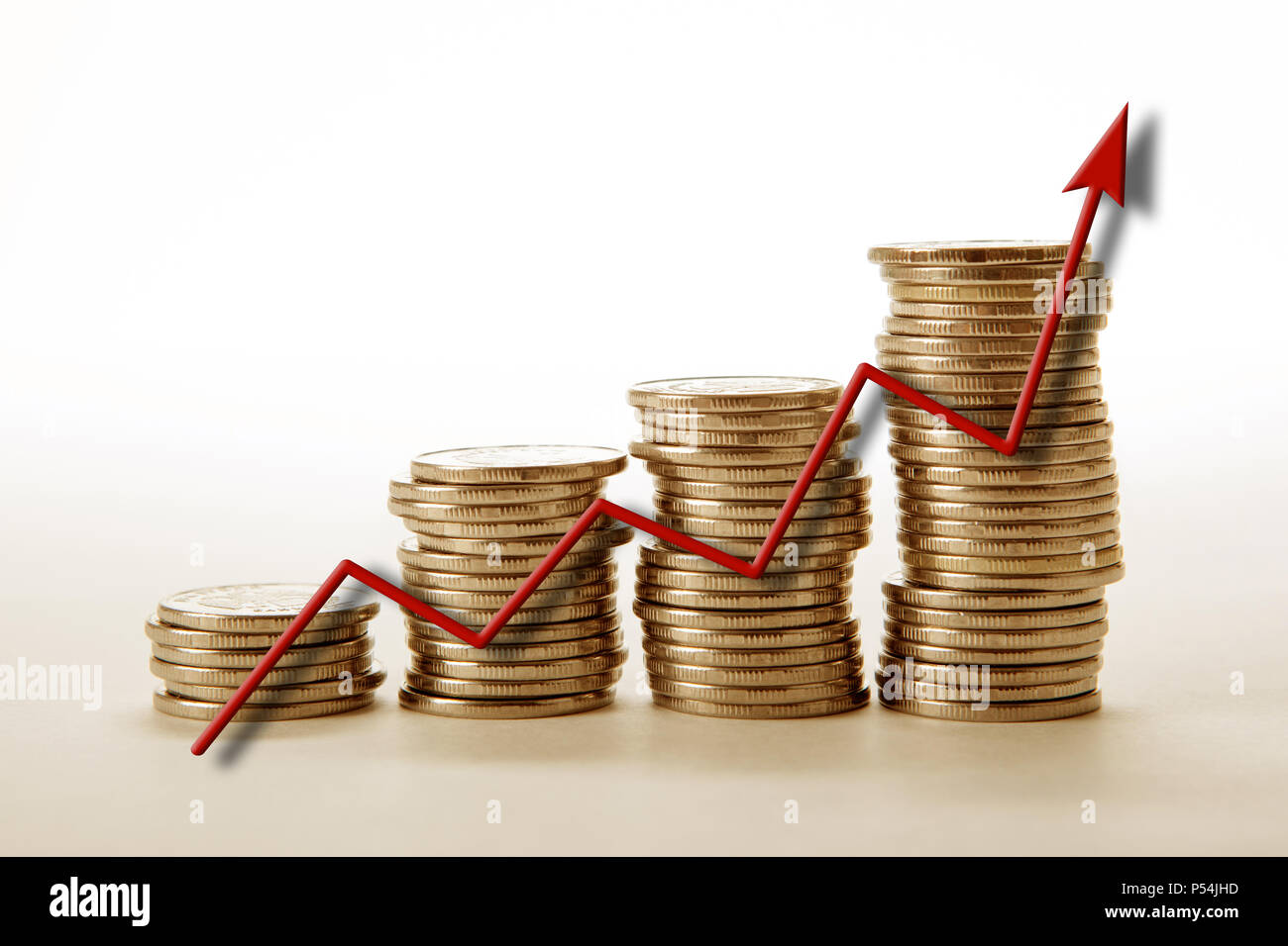 stacks of coins with diagram close up Stock Photo - Alamy