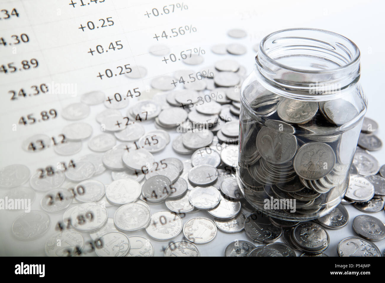 bank with coins and counting close up Stock Photo - Alamy