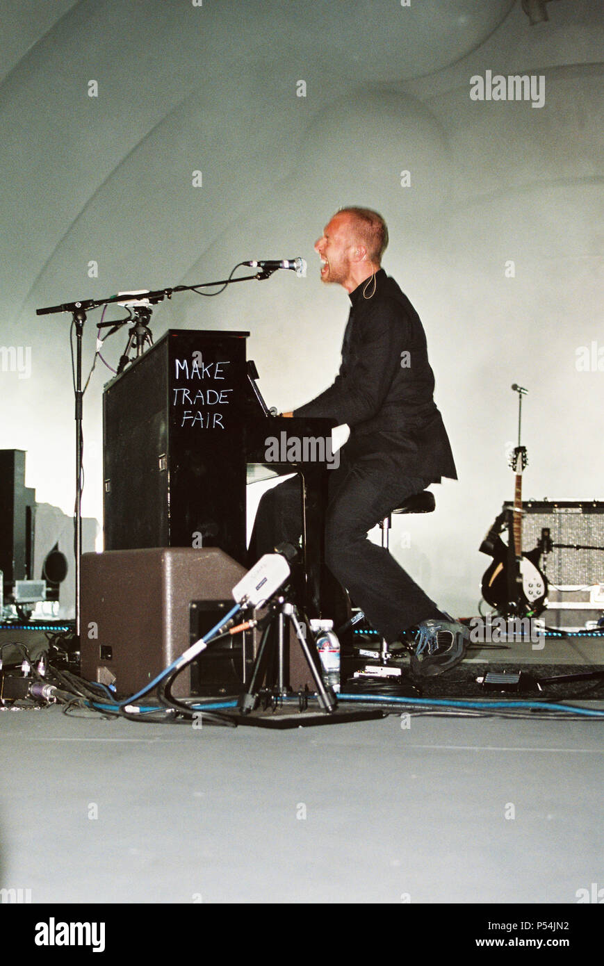 Chris Martin lead singer in Coldplay performing at the Hollywood Bowl ...