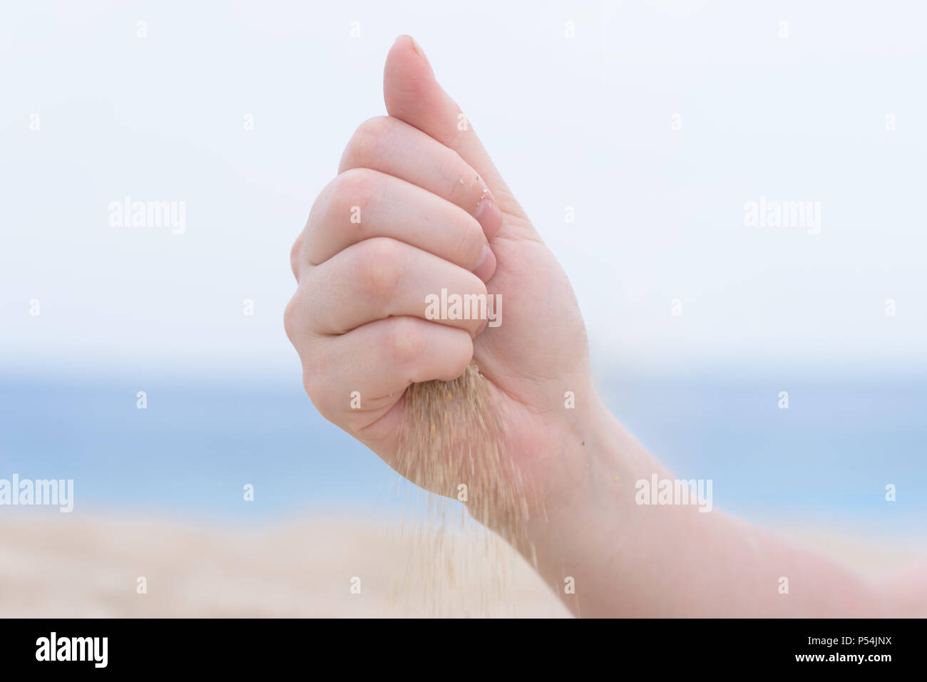 Hand with sand on the beach. Macro snapshot of hand with sand Stock ...
