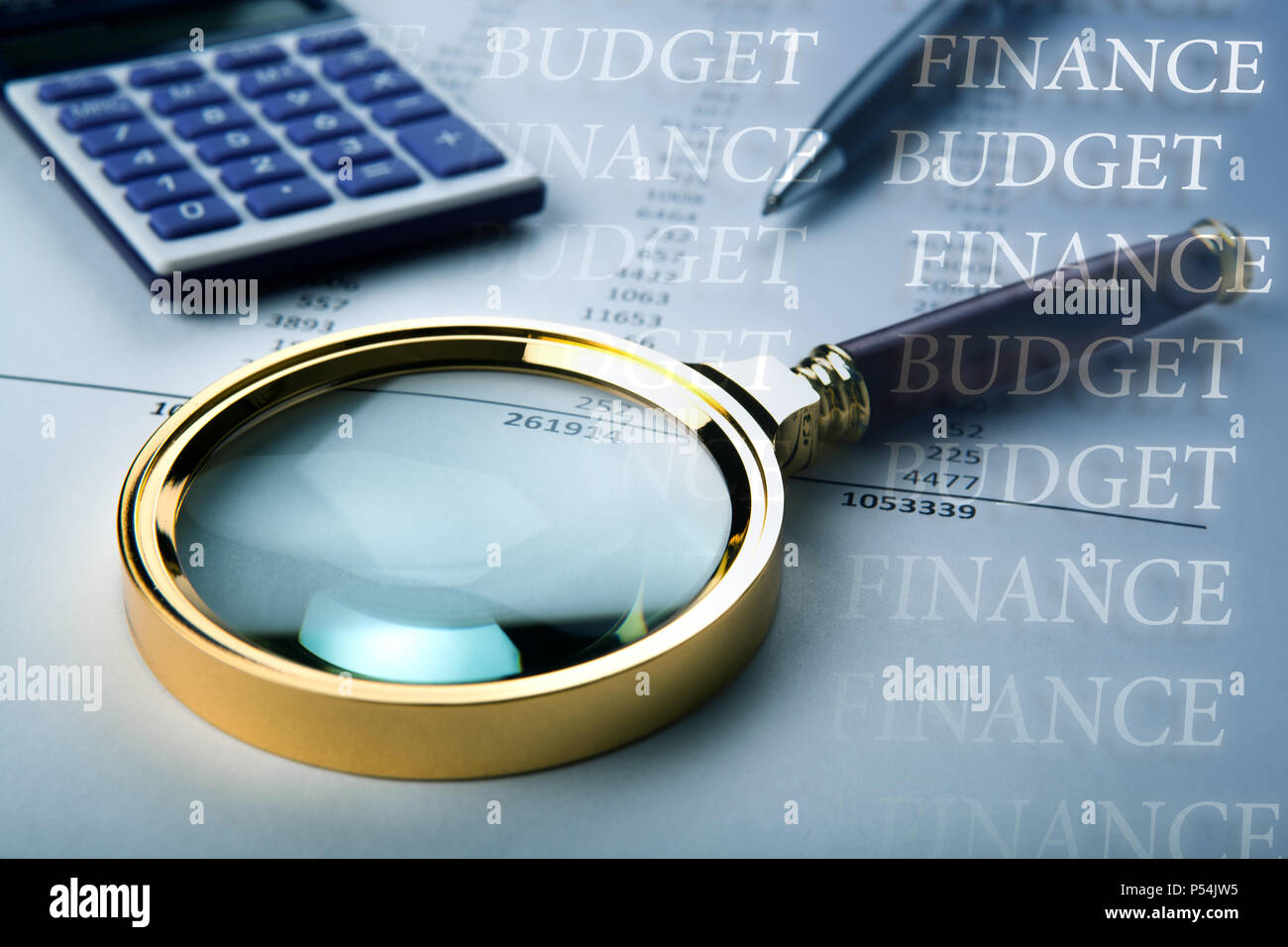 work on the budget with a magnifying glass, a calculator Stock Photo ...