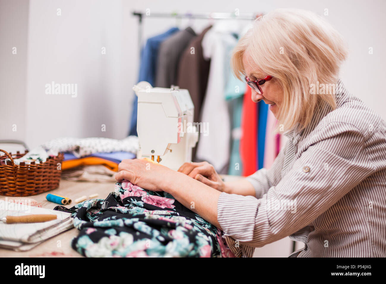 Beautiful seamstress blonde in sewing hi-res stock photography and ...
