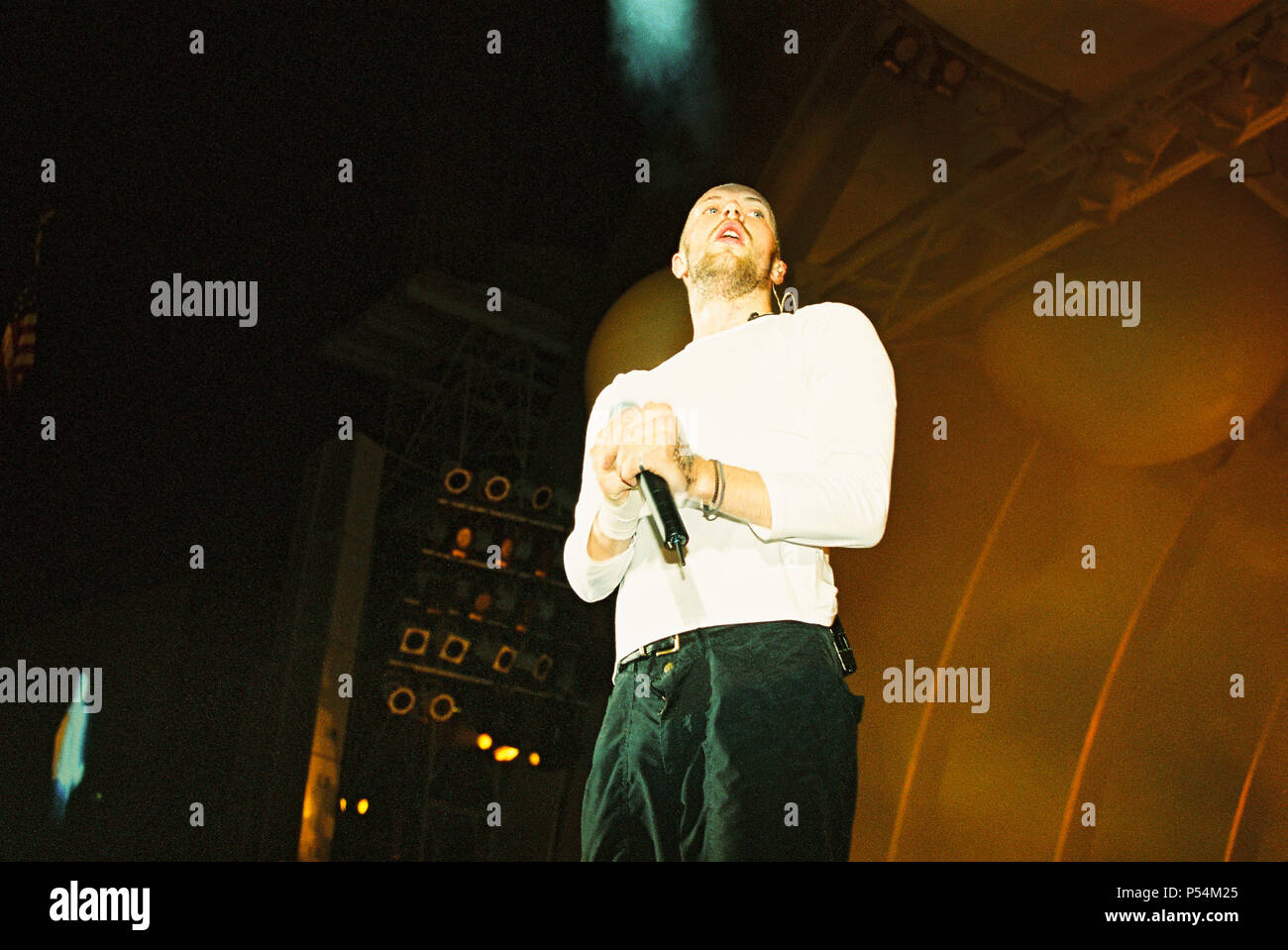 Chris Martin lead singer in Coldplay performing at the Hollywood Bowl ...
