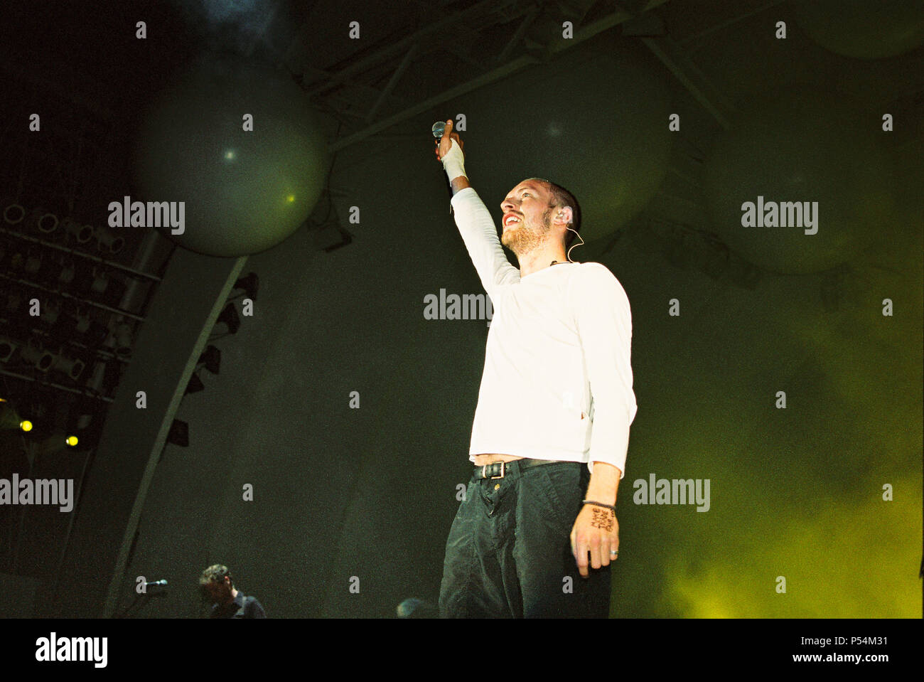 Chris Martin lead singer in Coldplay performing at the Hollywood Bowl ...