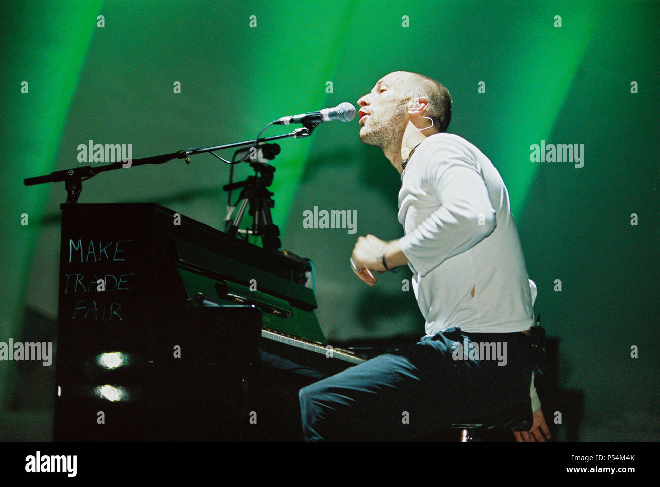 Chris Martin lead singer in Coldplay performing at the Hollywood Bowl ...