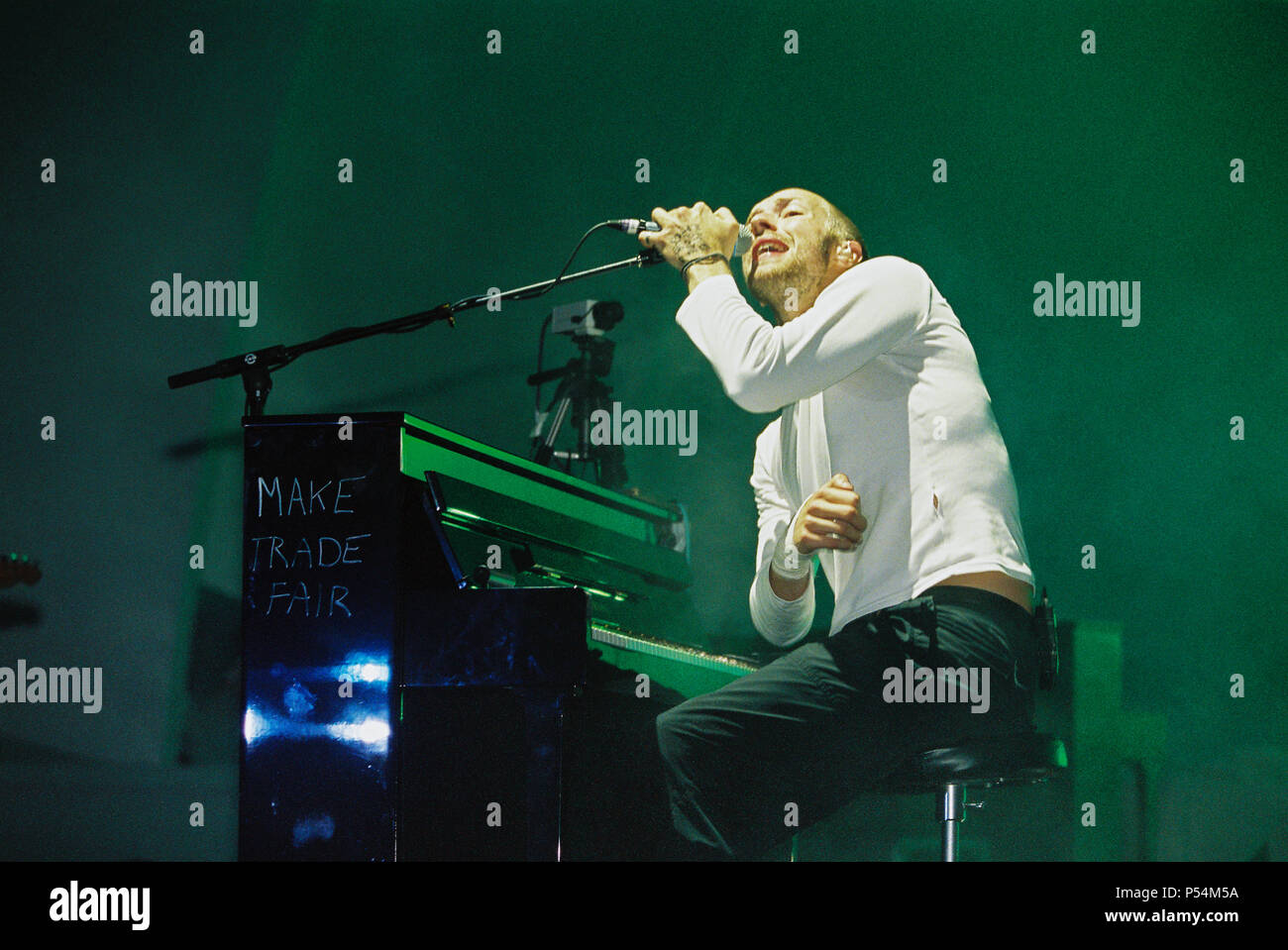 Chris Martin lead singer in Coldplay performing at the Hollywood Bowl ...