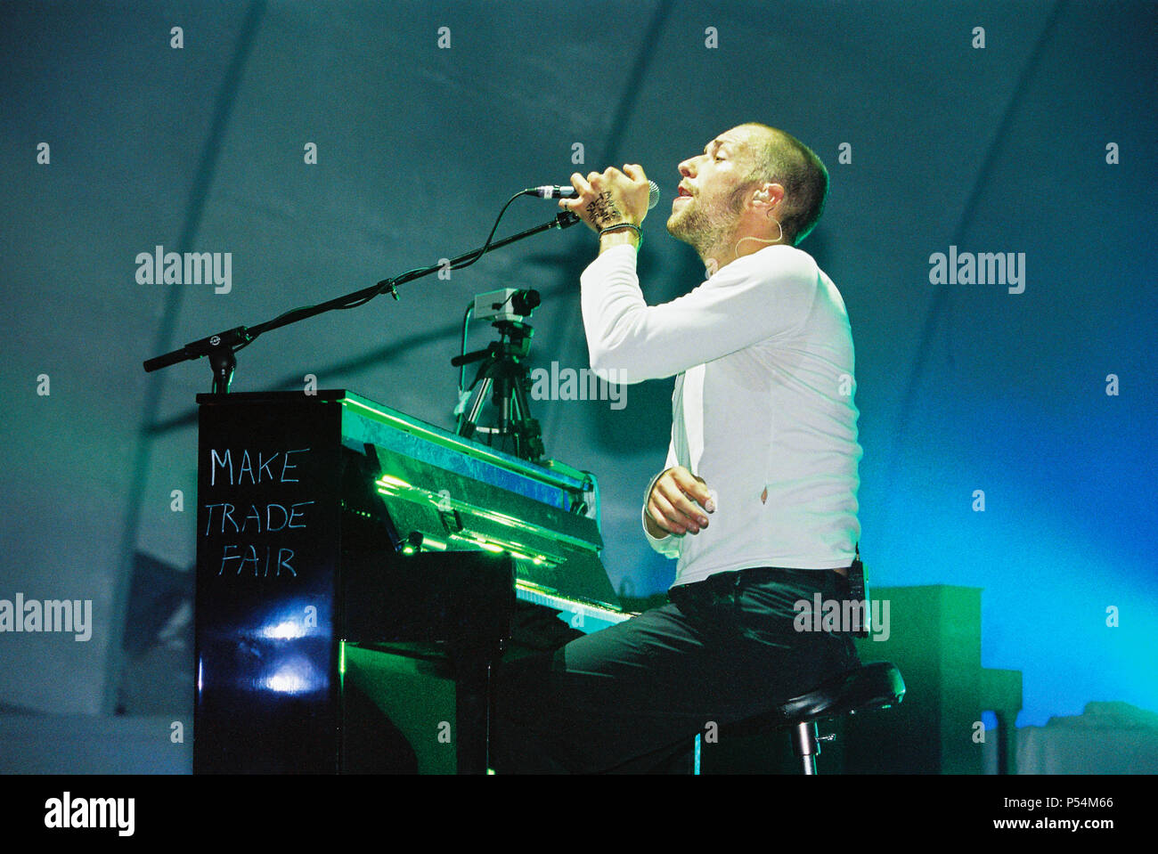 Chris Martin lead singer in Coldplay performing at the Hollywood Bowl ...