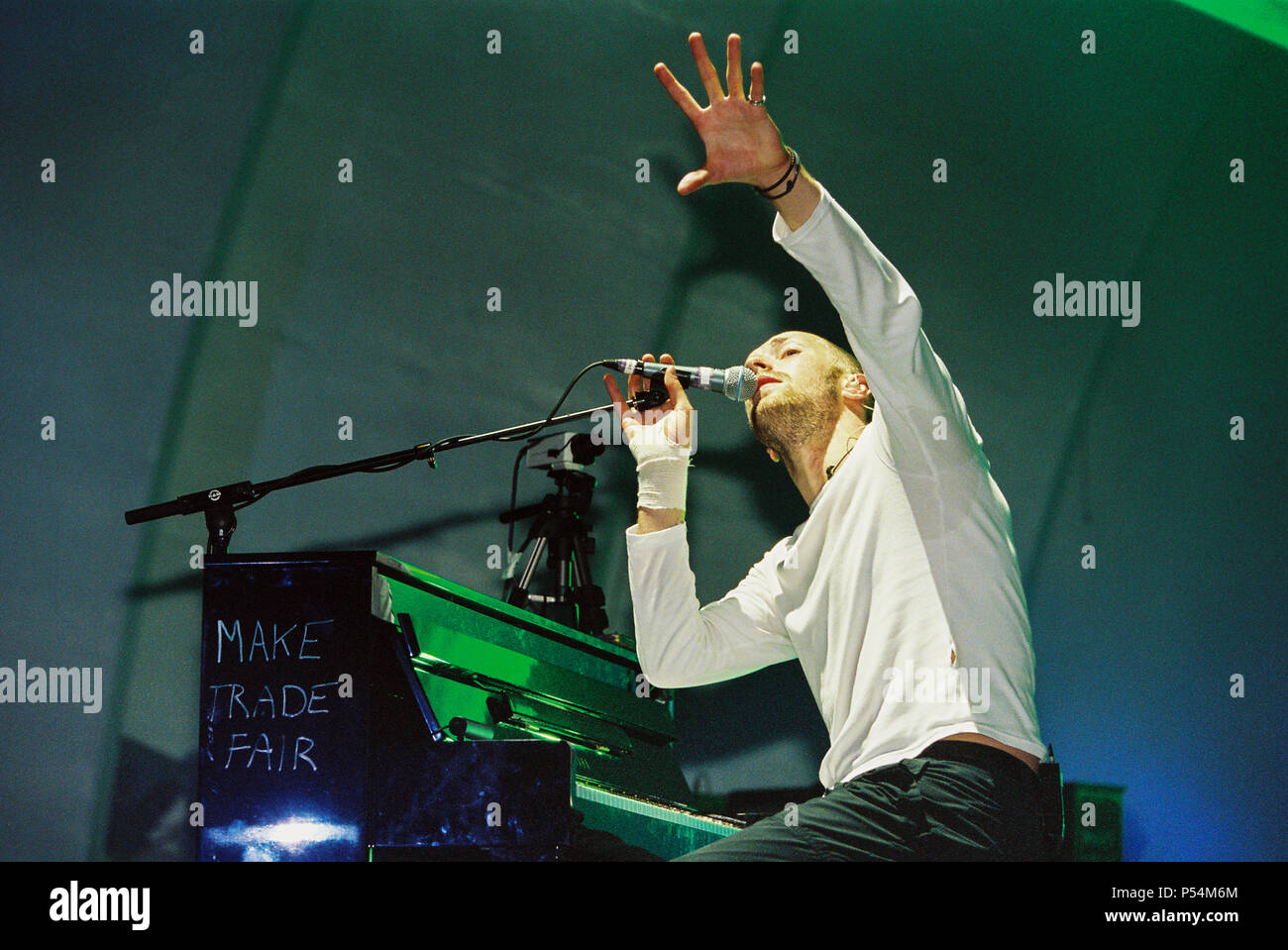 Chris Martin lead singer in Coldplay performing at the Hollywood Bowl ...