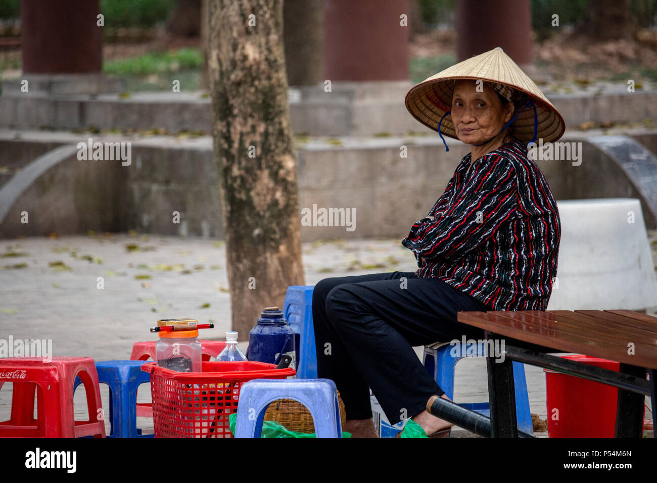 Hanoi, Vietnam - March 16, 2018: Local vietnamese woman sitting in her ...