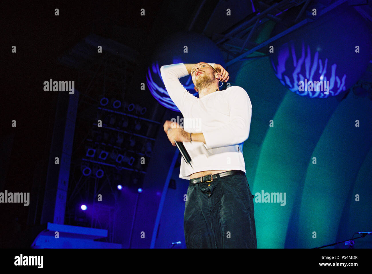 Chris Martin lead singer in Coldplay performing at the Hollywood Bowl ...