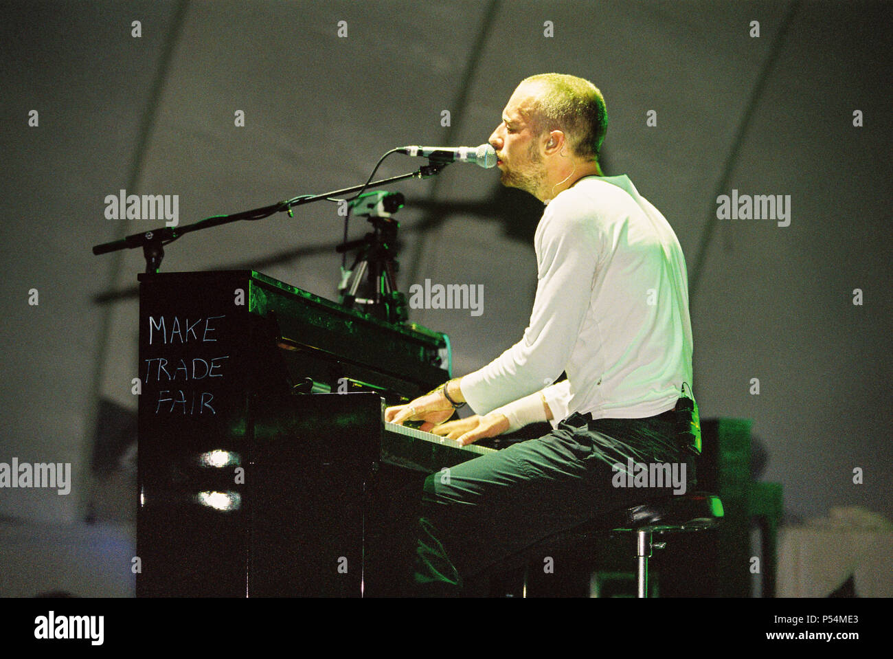 Chris Martin lead singer in Coldplay performing at the Hollywood Bowl ...