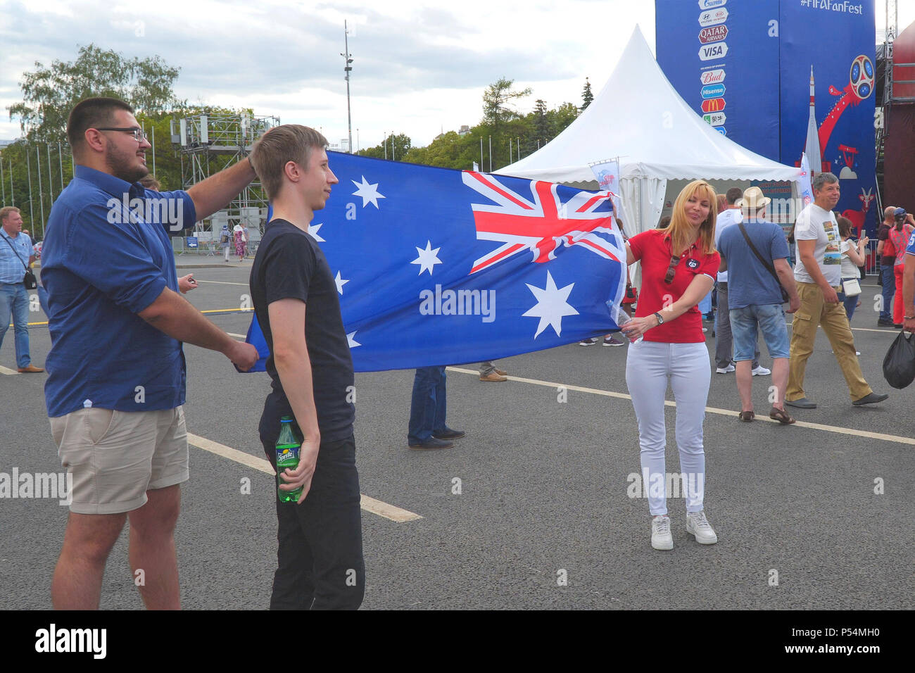 Football fans with the flag of Australia in the fan zone of the world ...