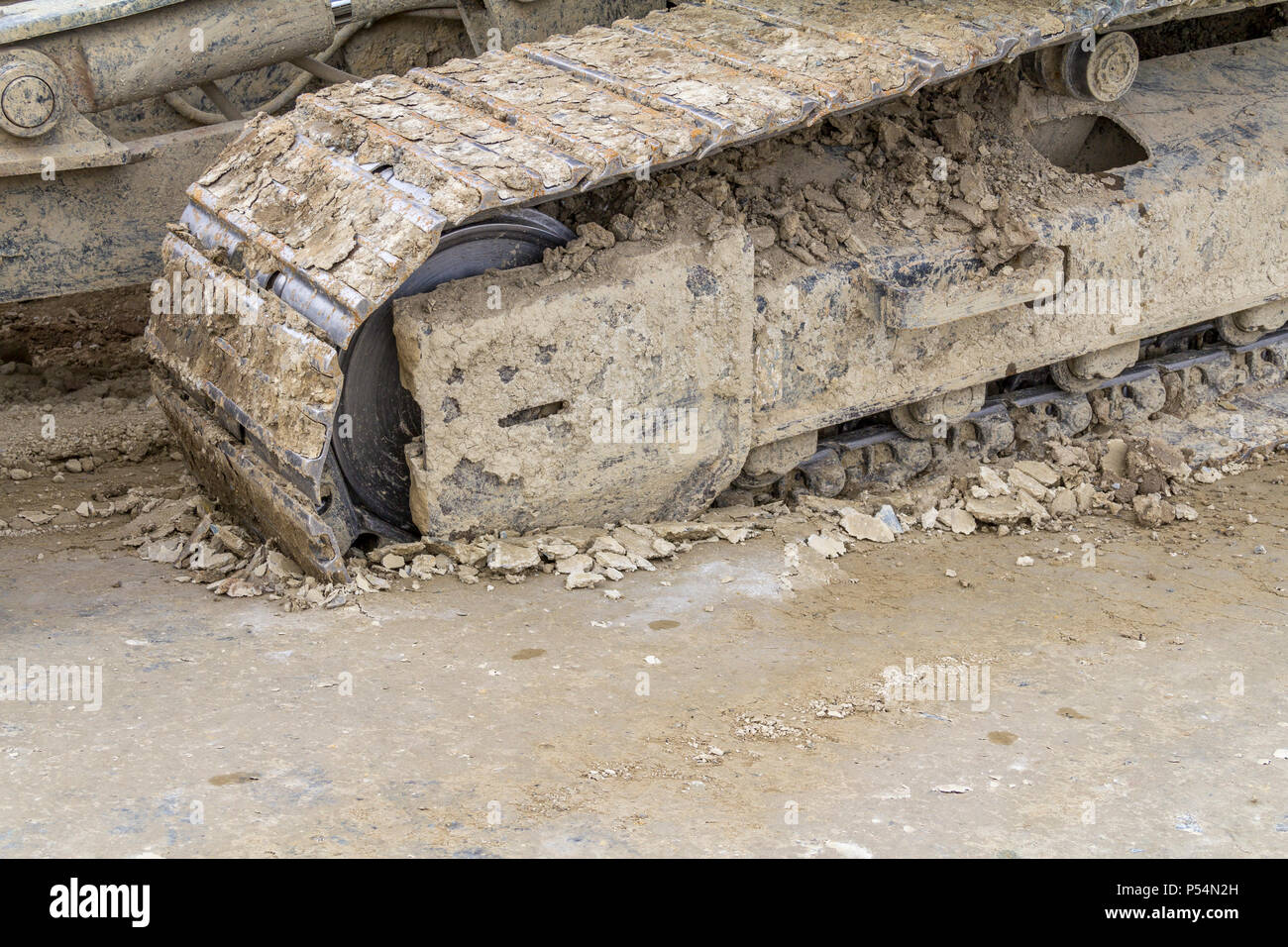 detail of some crawler tracks partly buried in muddy loam ambiance ...