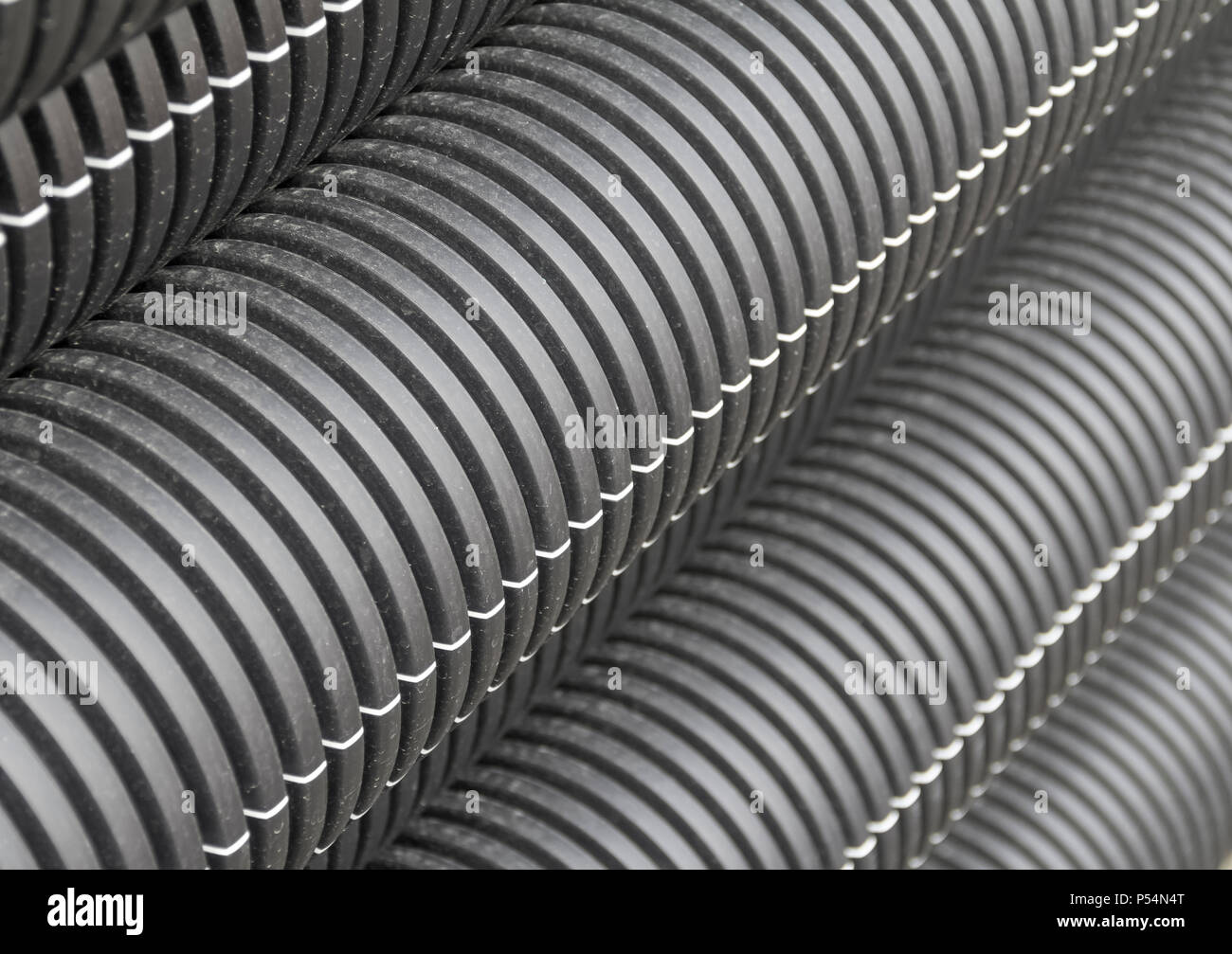 full frame black corrugated pipes closeup Stock Photo - Alamy
