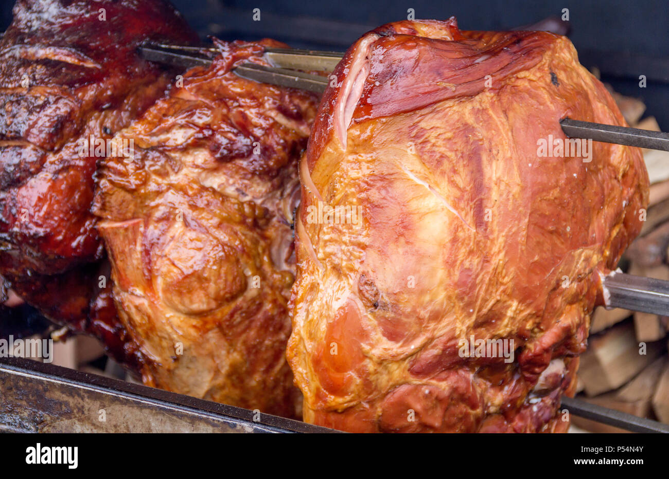 pork barbecue scenery with big roasting meat pieces on a spit Stock ...