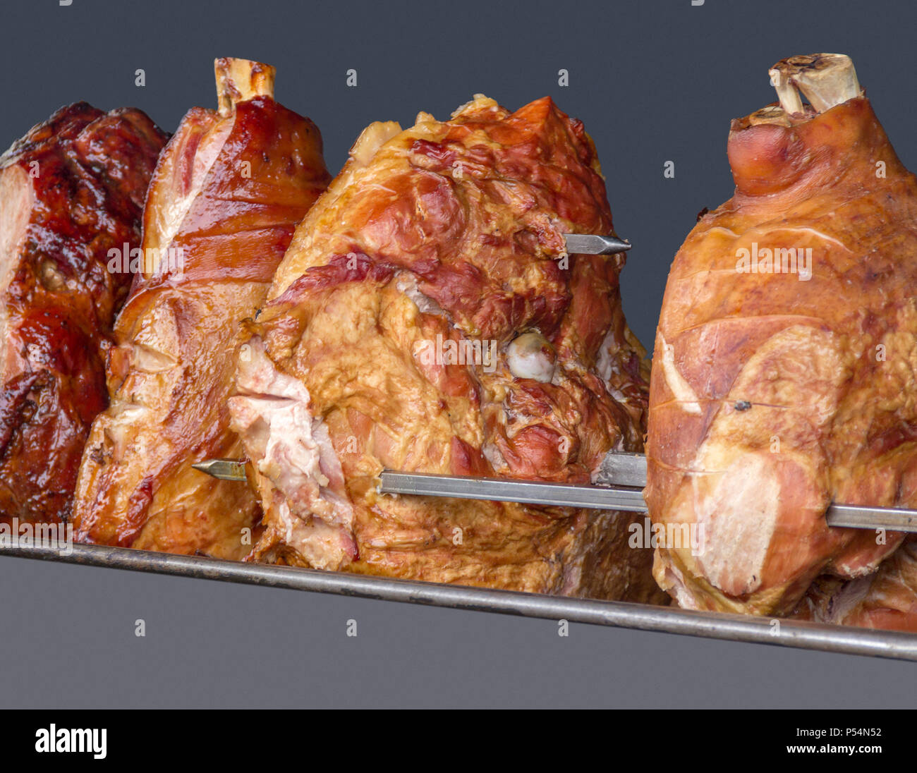 pork barbecue scenery with big roasting meat pieces on a spit Stock ...