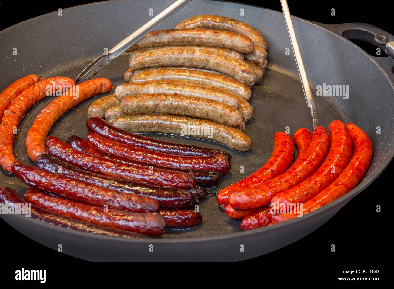 barbecue scenery with lots of various roasted sausages in a pan Stock ...