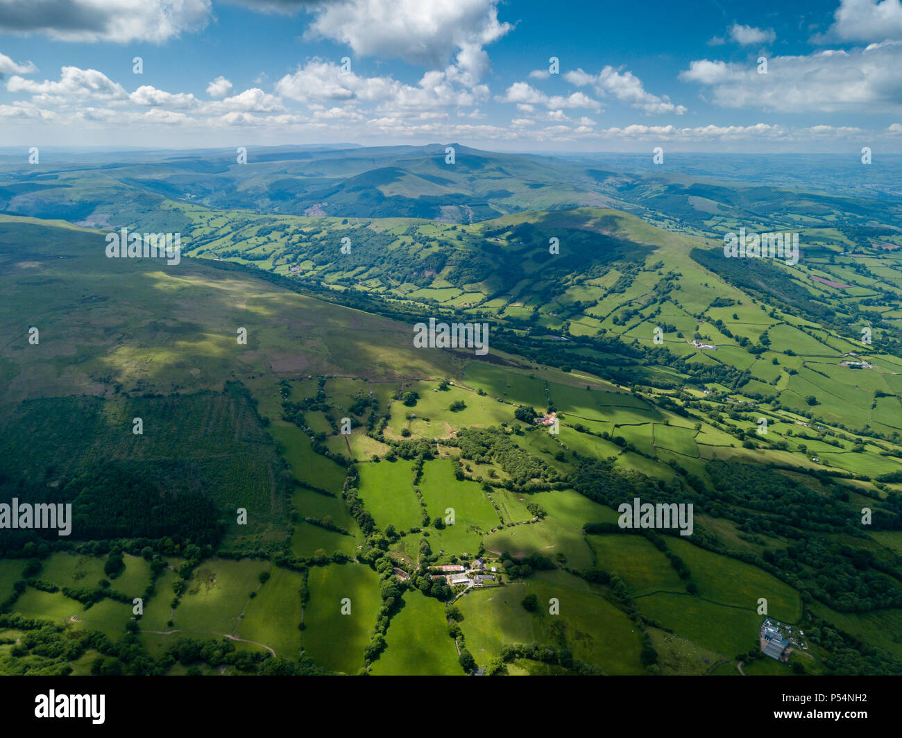 Aerial view of green farmland and fields in the rural Welsh countryside ...