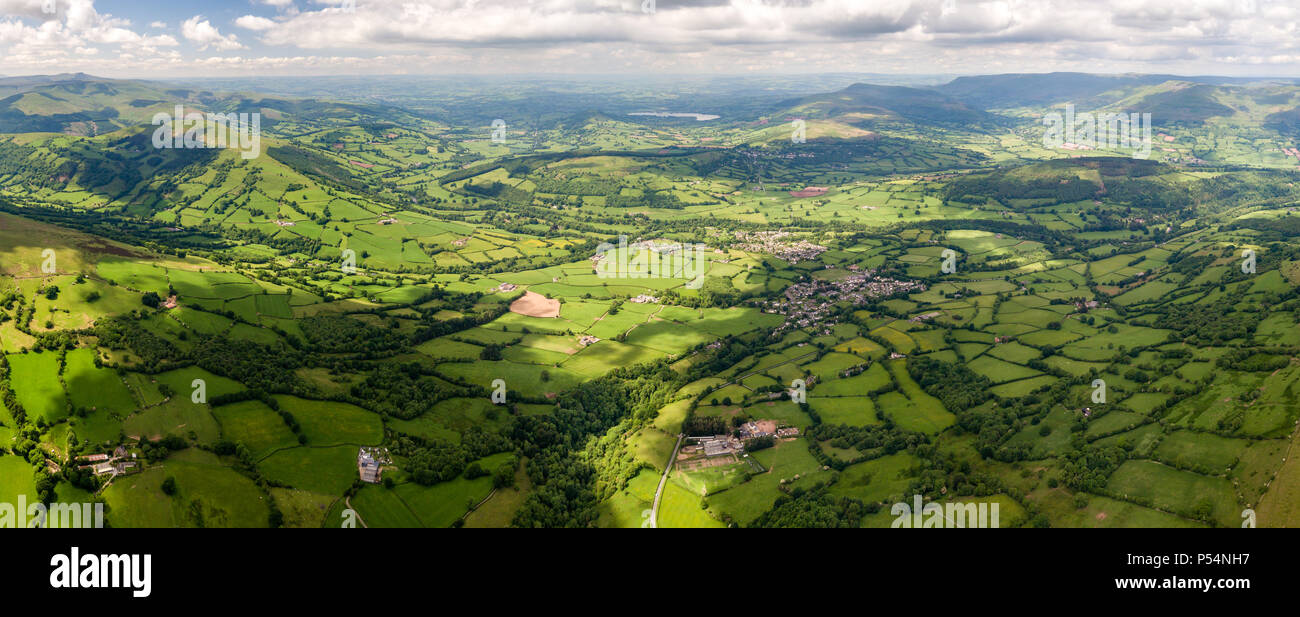Panoramic aerial view of green farmland and fields in the rural Welsh ...