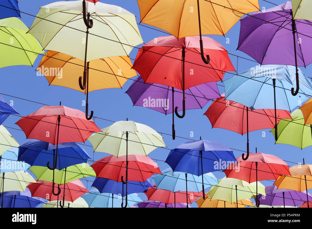 Decorative umbrellas hanging against sky hi-res stock photography and ...