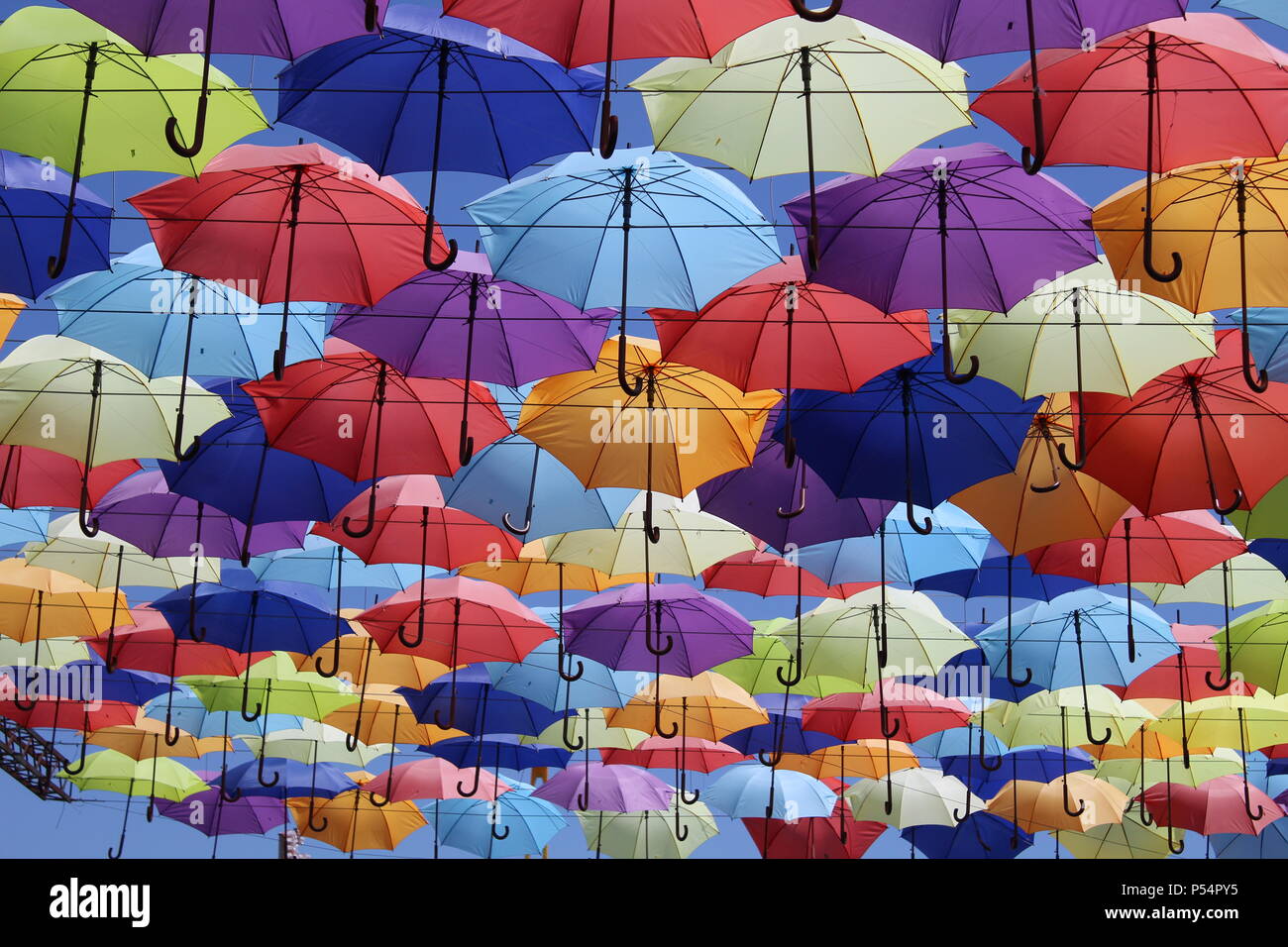 Flying yellow umbrella hi-res stock photography and images - Alamy