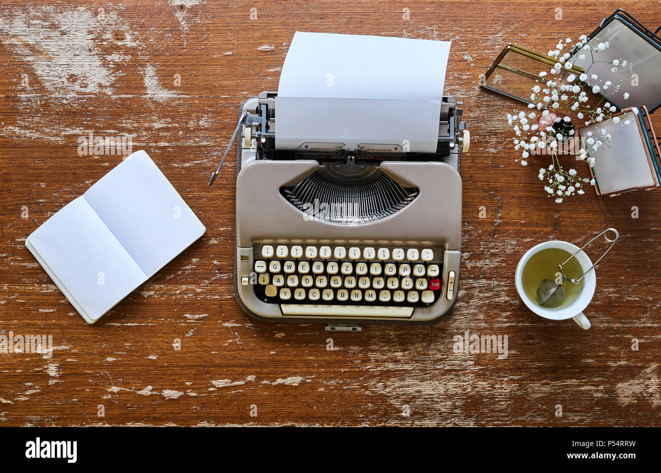 vintage typewriter and pretty decoration on wooden desktop Stock Photo ...