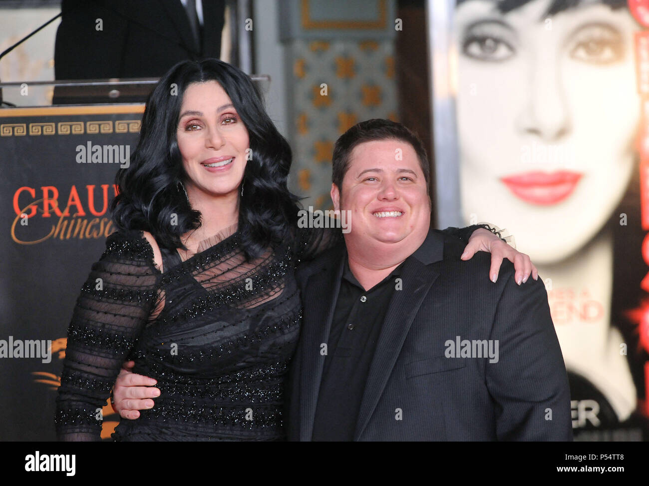 CHER and her son Chaz at the Hand and Foot Print at the Chinese Theatre ...