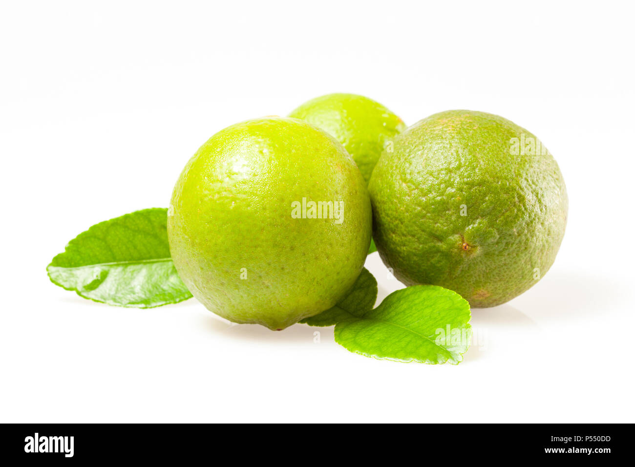 Lime fruits and piece with leaves isolated on white background Stock ...