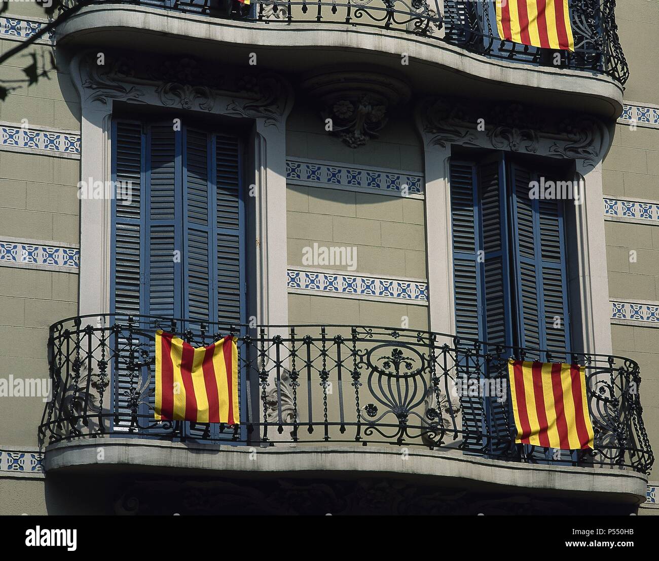 Flags hanging from balcony hi-res stock photography and images - Alamy