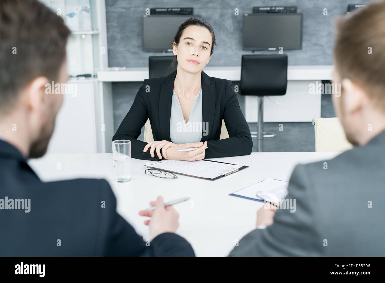 Female Boss Listening to Partners at Negotiations Stock Photo - Alamy