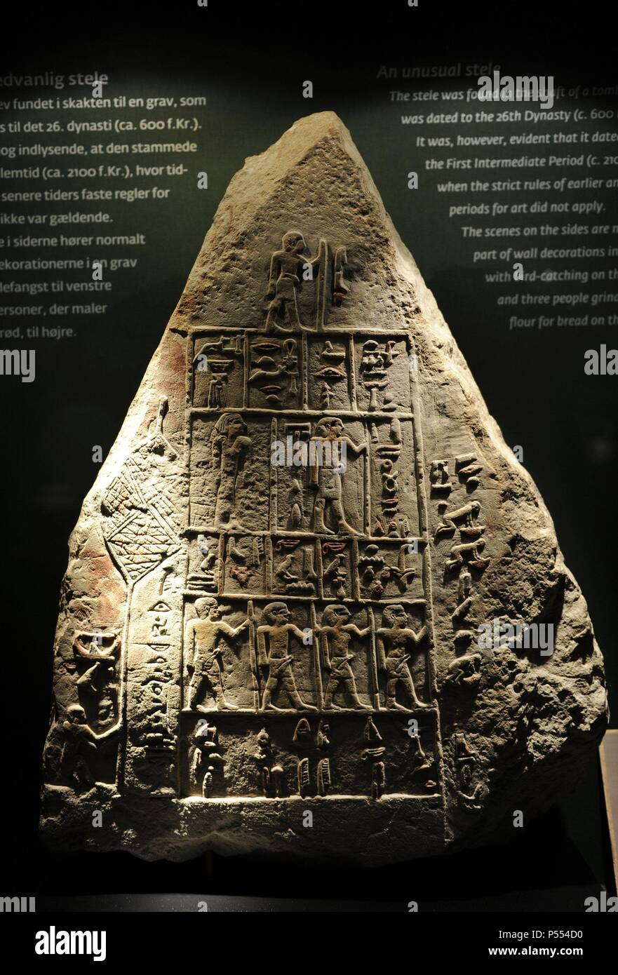 Tomb stele of the man Ib. At the top, Ib with a staff and bellow him ...