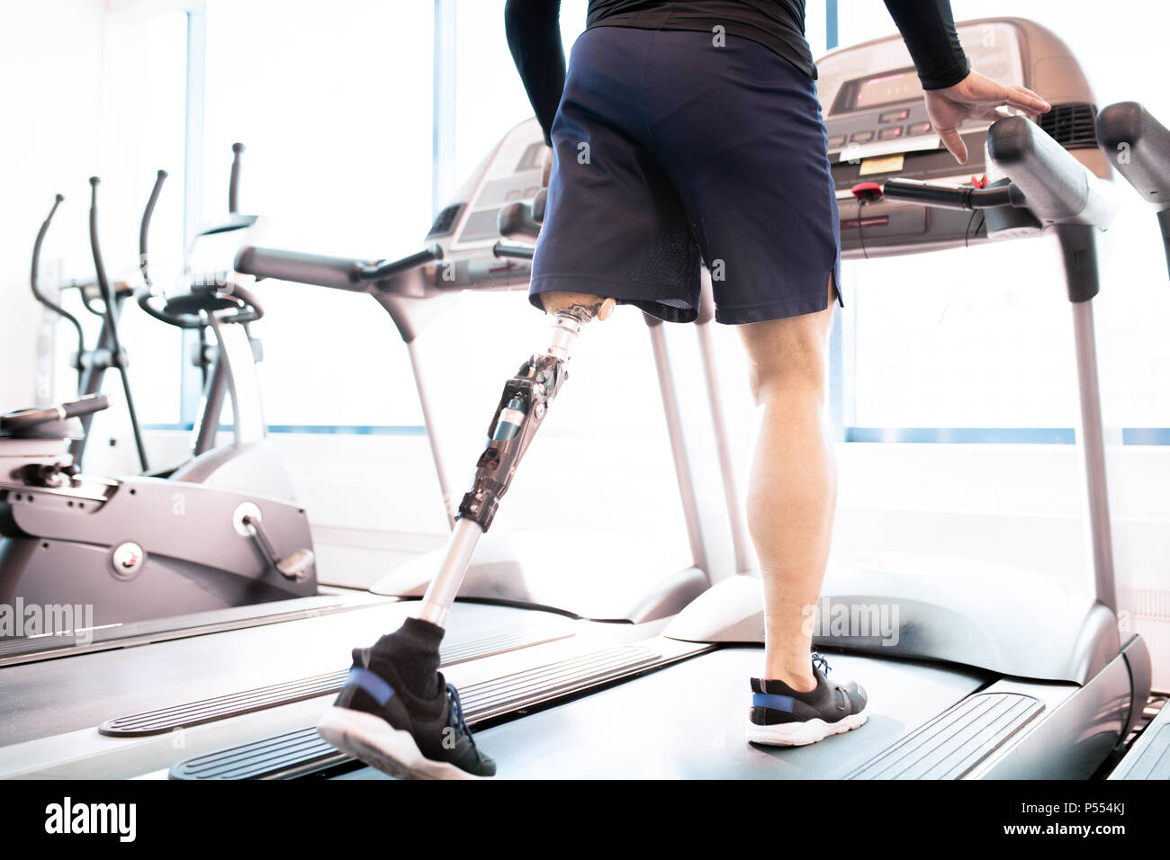 Handicapped Muscular Man Running on Treadmill Stock Photo - Alamy Handicapped Muscular Man Running on Treadmill Stock Photo - Alamy