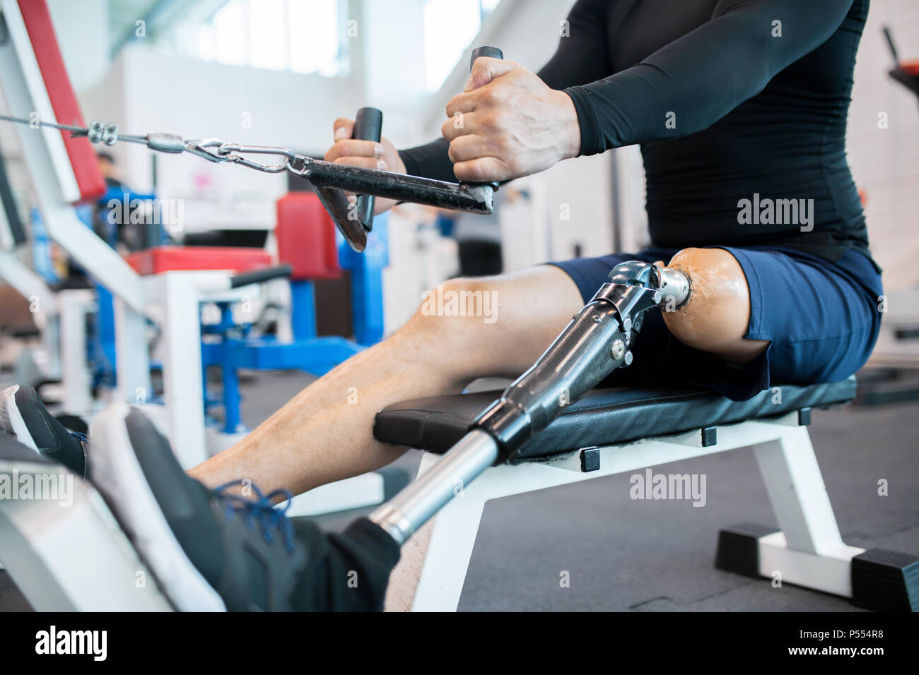 Adaptive Athlete Using Rowing Machine Closeup Stock Photo - Alamy