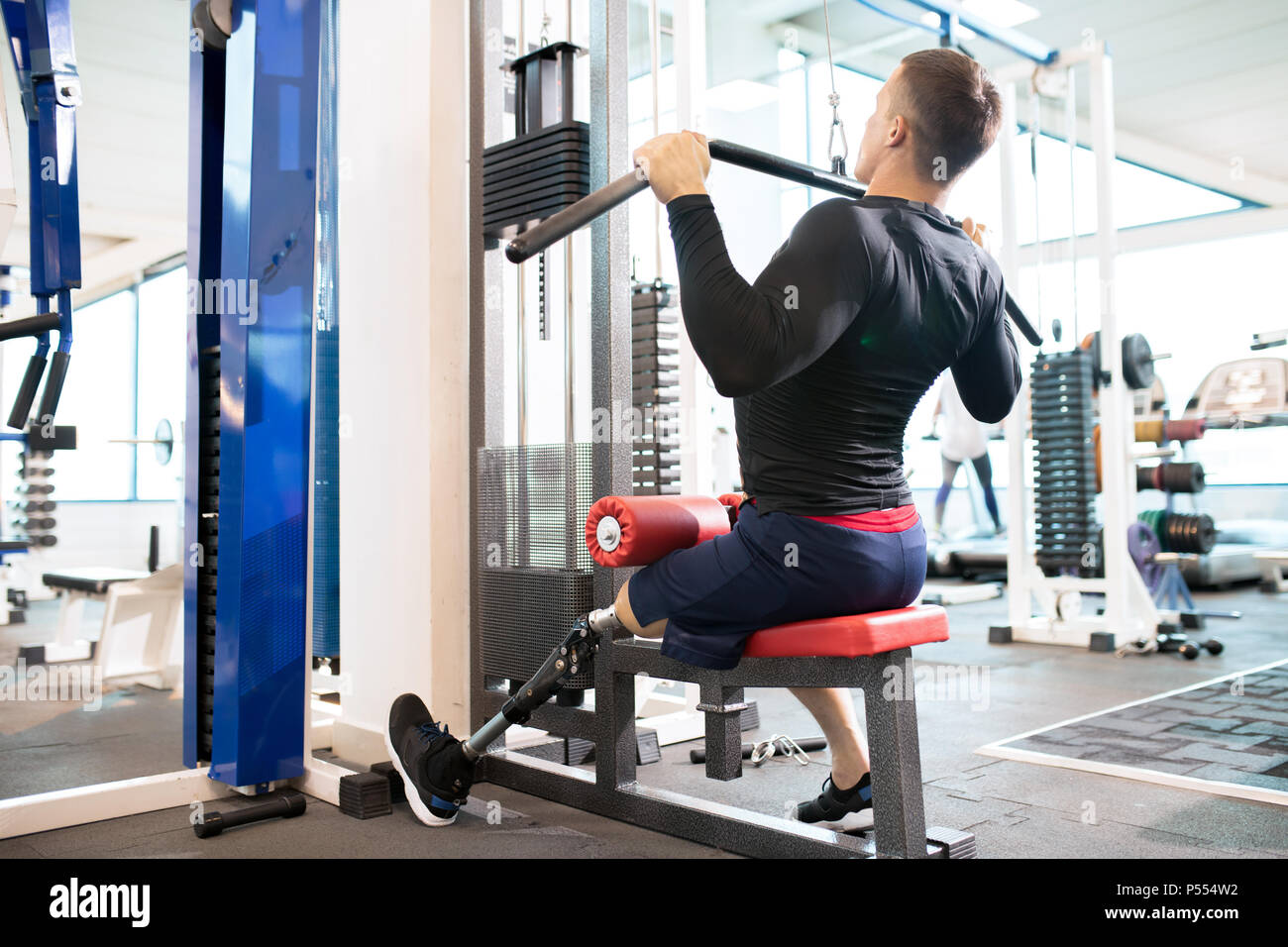 Adaptive Athlete Using Exercise Machines Stock Photo - Alamy