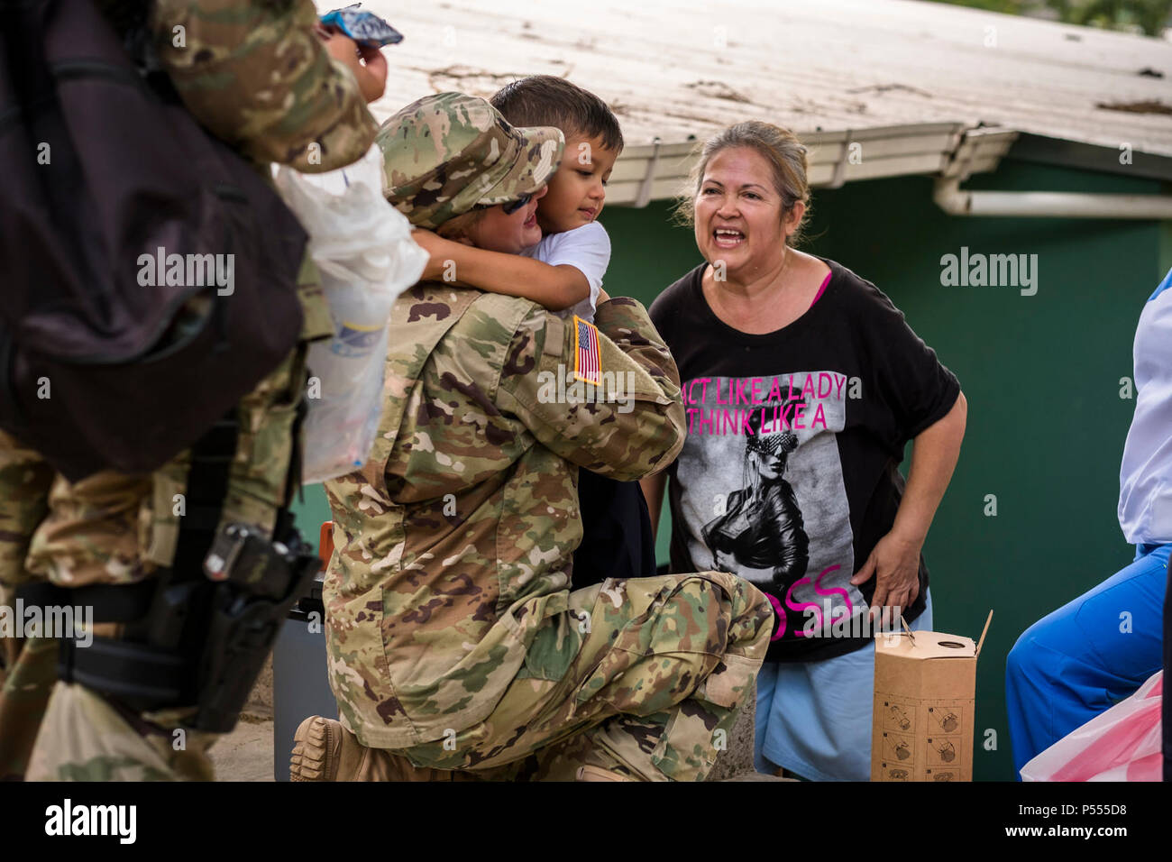 U.S. Army Lt. Col. Rhonda Dyer, Joint Task Force - Bravo, gets a hug ...