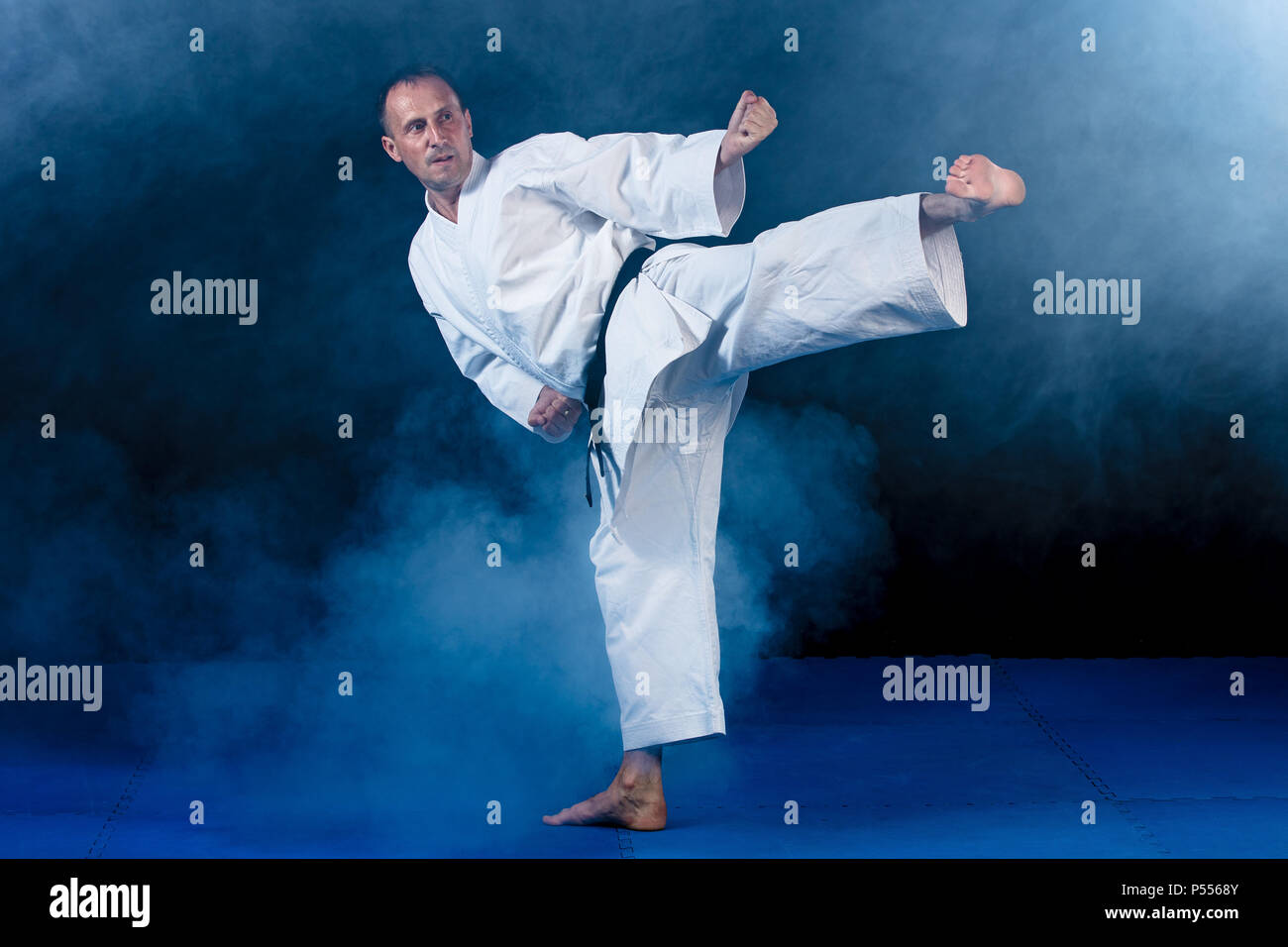 White Karate Fighter Isolated On Black with smoke effect Stock Photo ...