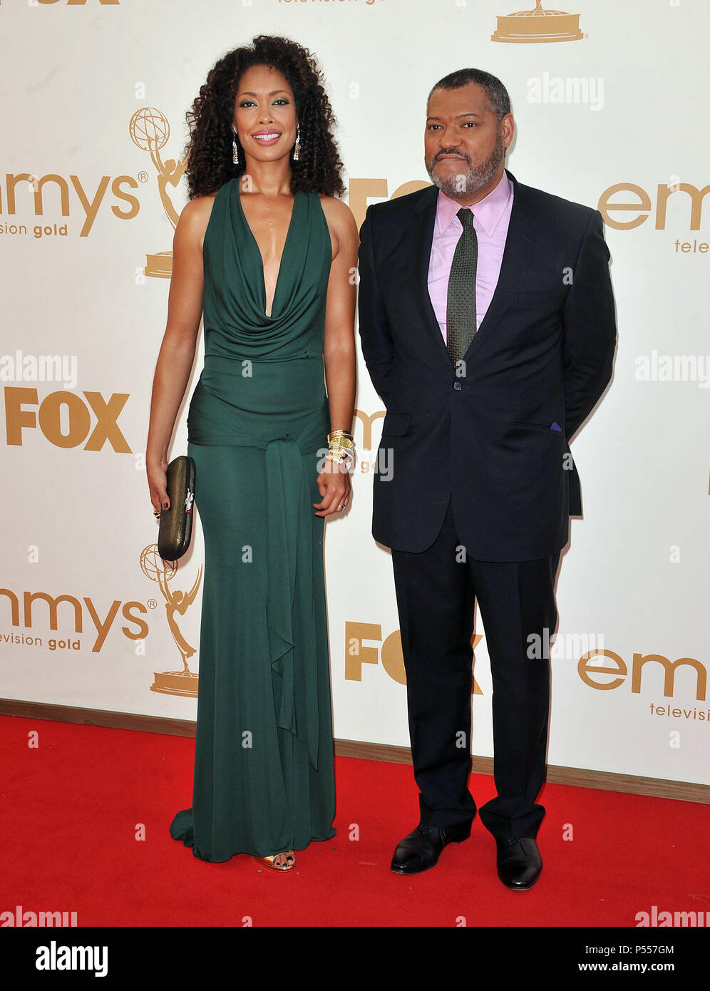 Lawrence Fishburne, Gina Torres arriving at the 2011 Emmy Awards at the ...