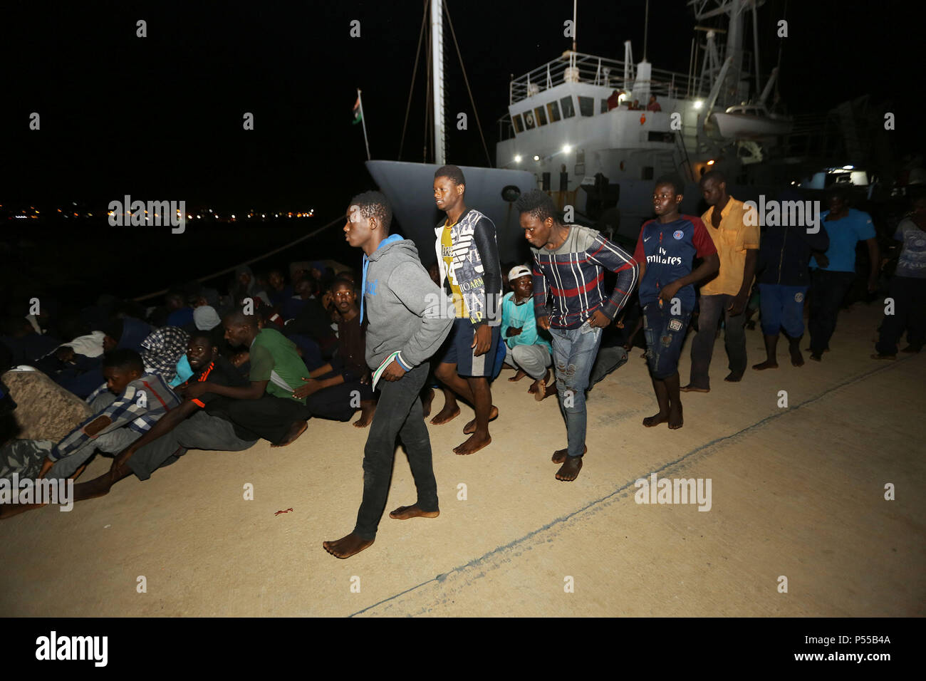 Tripoli. 25th June, 2018. Rescued immigrants are seen at a naval base ...