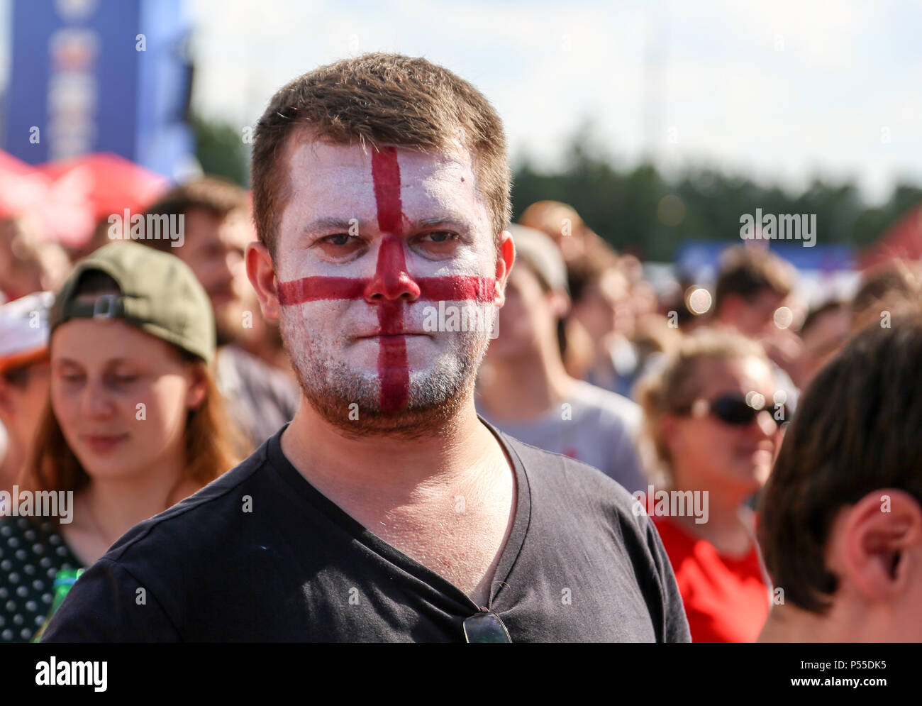 A fan of the England national team seen with his face painted in the ...