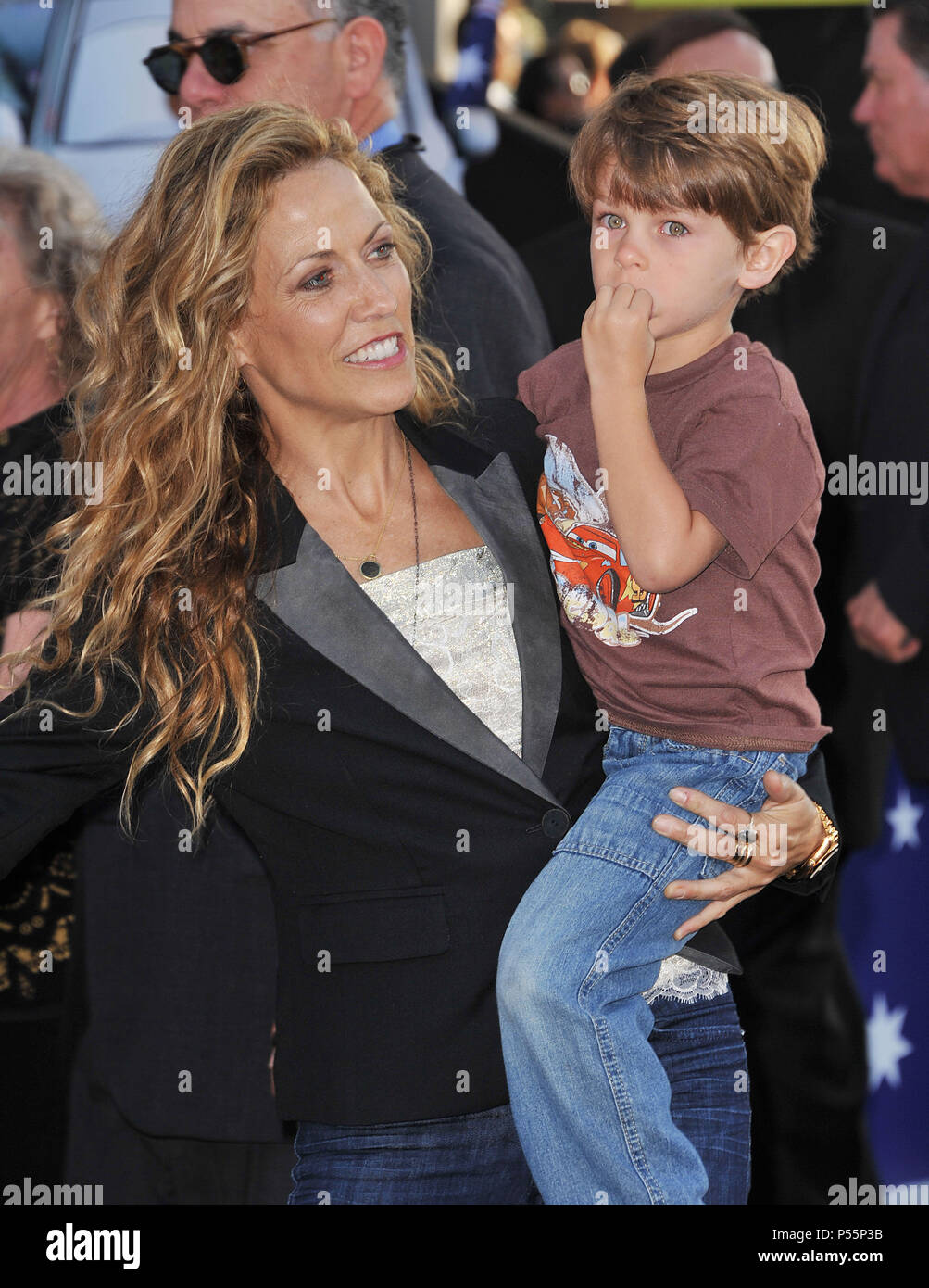 Sheryl Crow, son Wyatt at Cars 2 Premiere at the El Capitan Theatre In ...