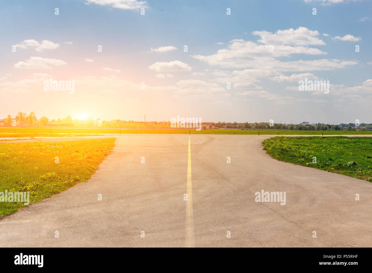 Empty airport taxiway with panoramic blue sky background. Airfield ...