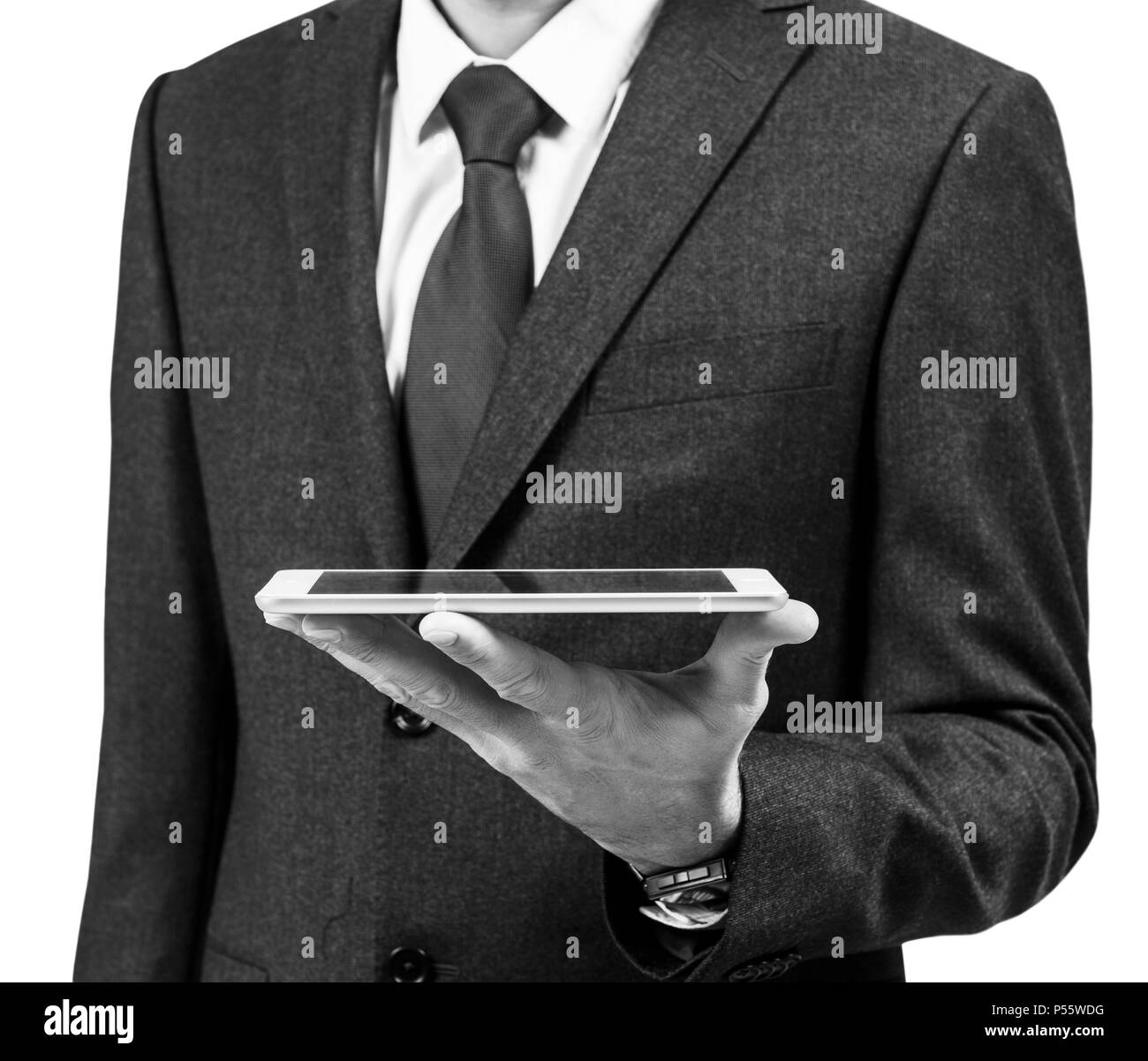 Businessman holds digital tablet. Isolated on white background. Future ...