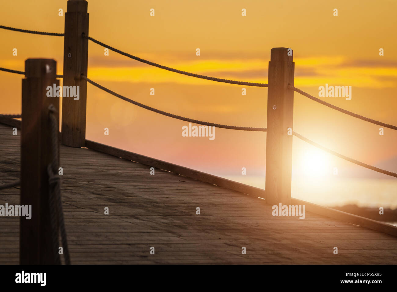 wooden pier at beautiful sunset Stock Photo - Alamy