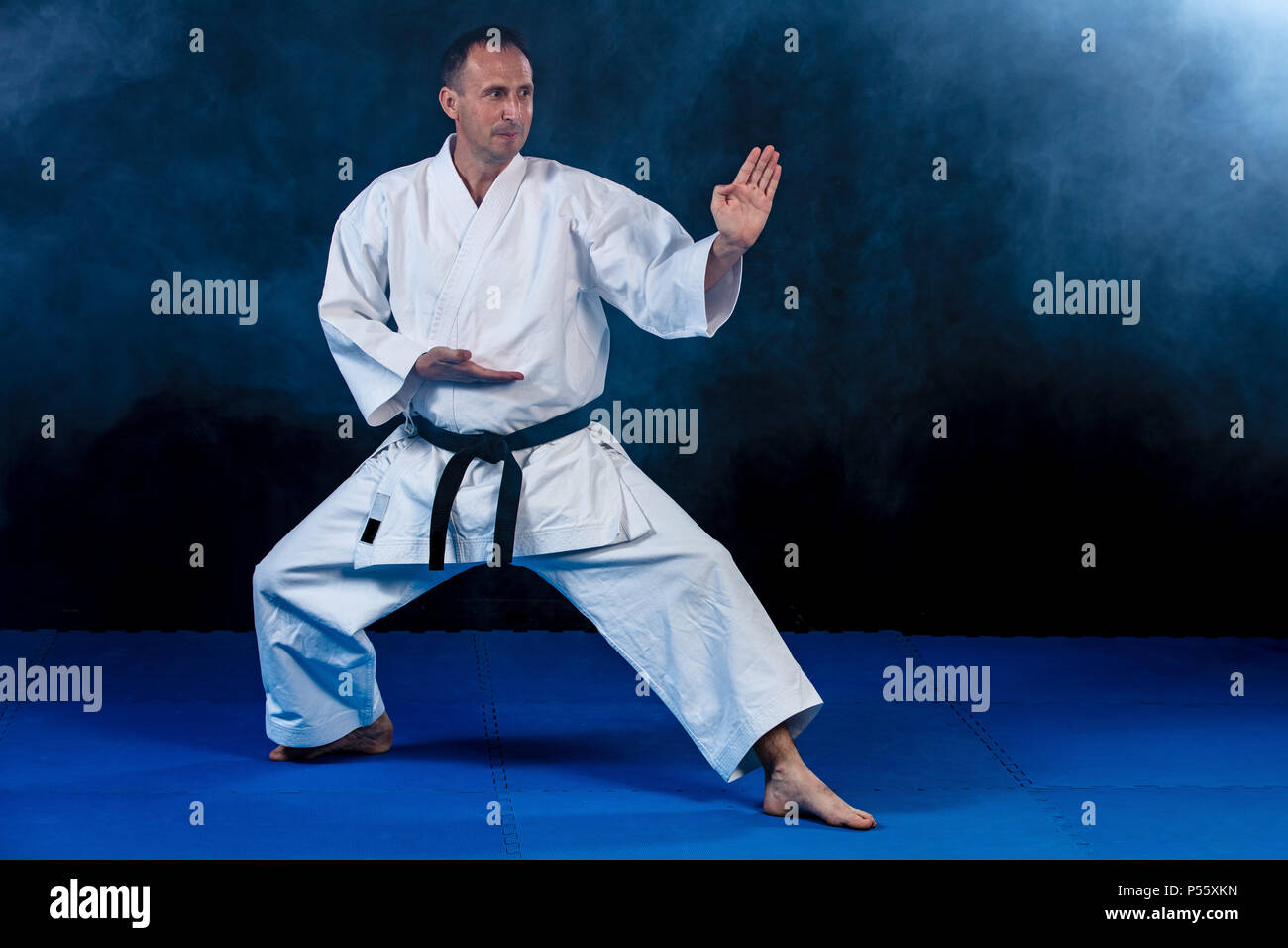 White Karate Fighter Isolated On Black with smoke effect Stock Photo ...