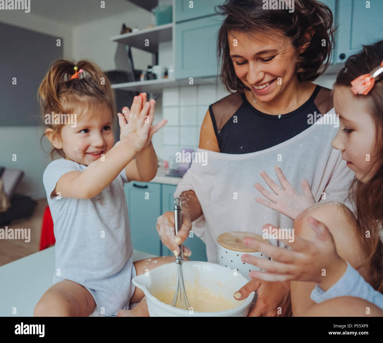 Happy family cook together in the kitchen Stock Photo - Alamy