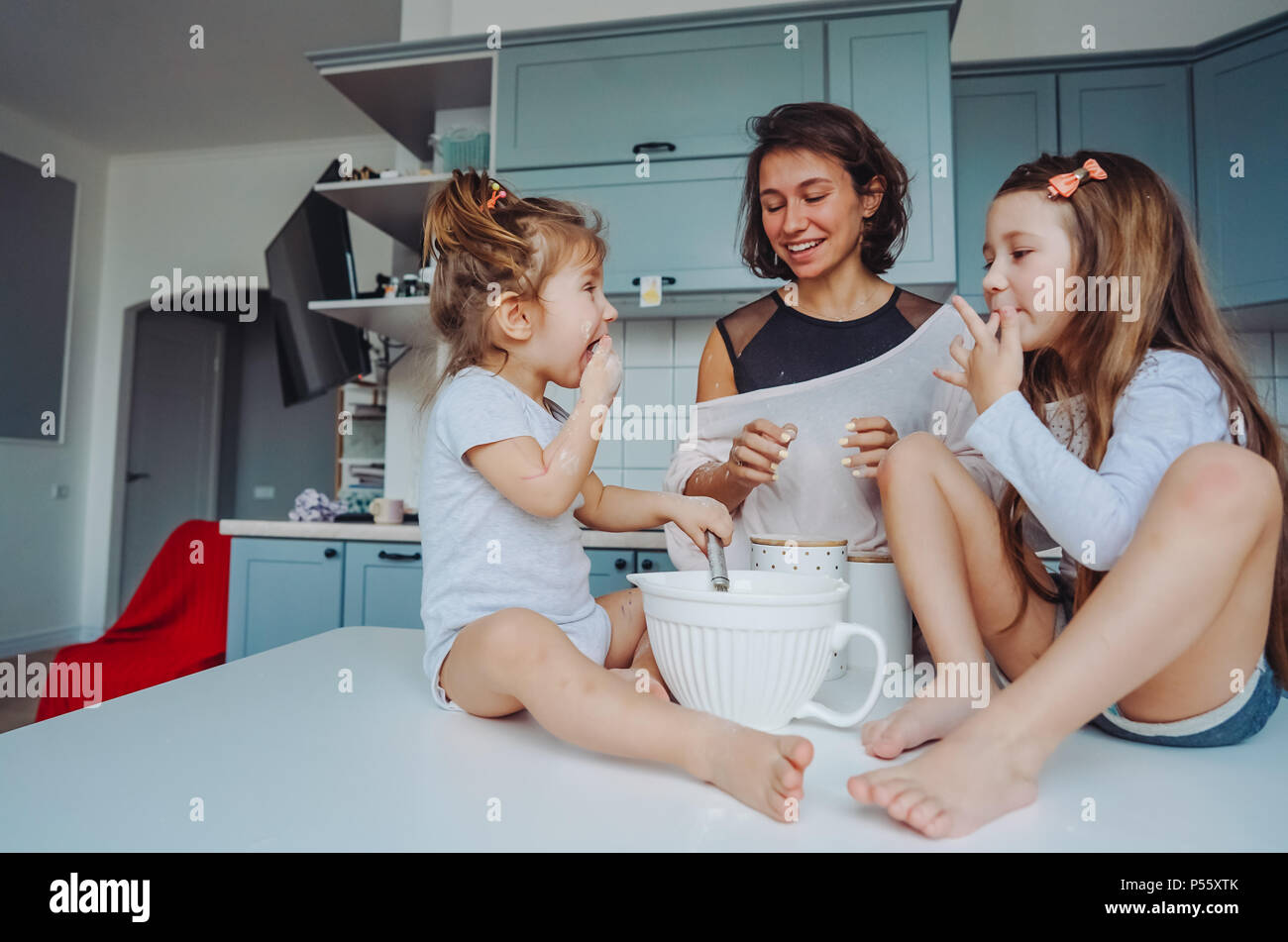 Happy family cook together in the kitchen Stock Photo - Alamy