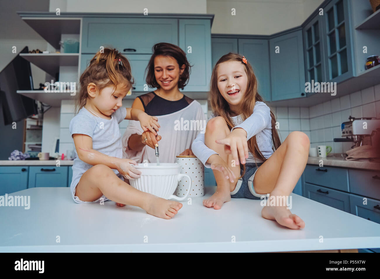 Happy family cook together in the kitchen Stock Photo - Alamy