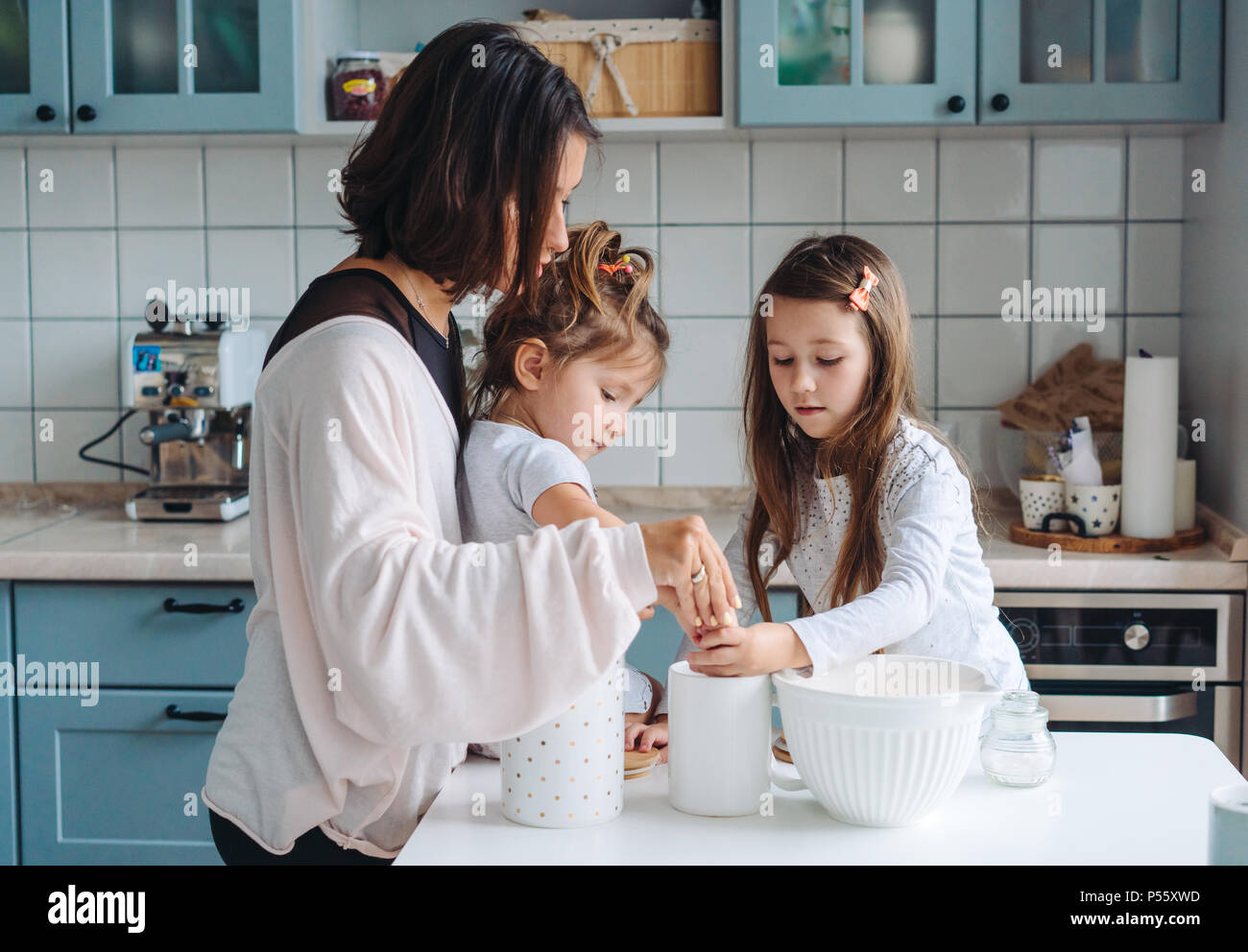 Happy family cook together in the kitchen Stock Photo - Alamy