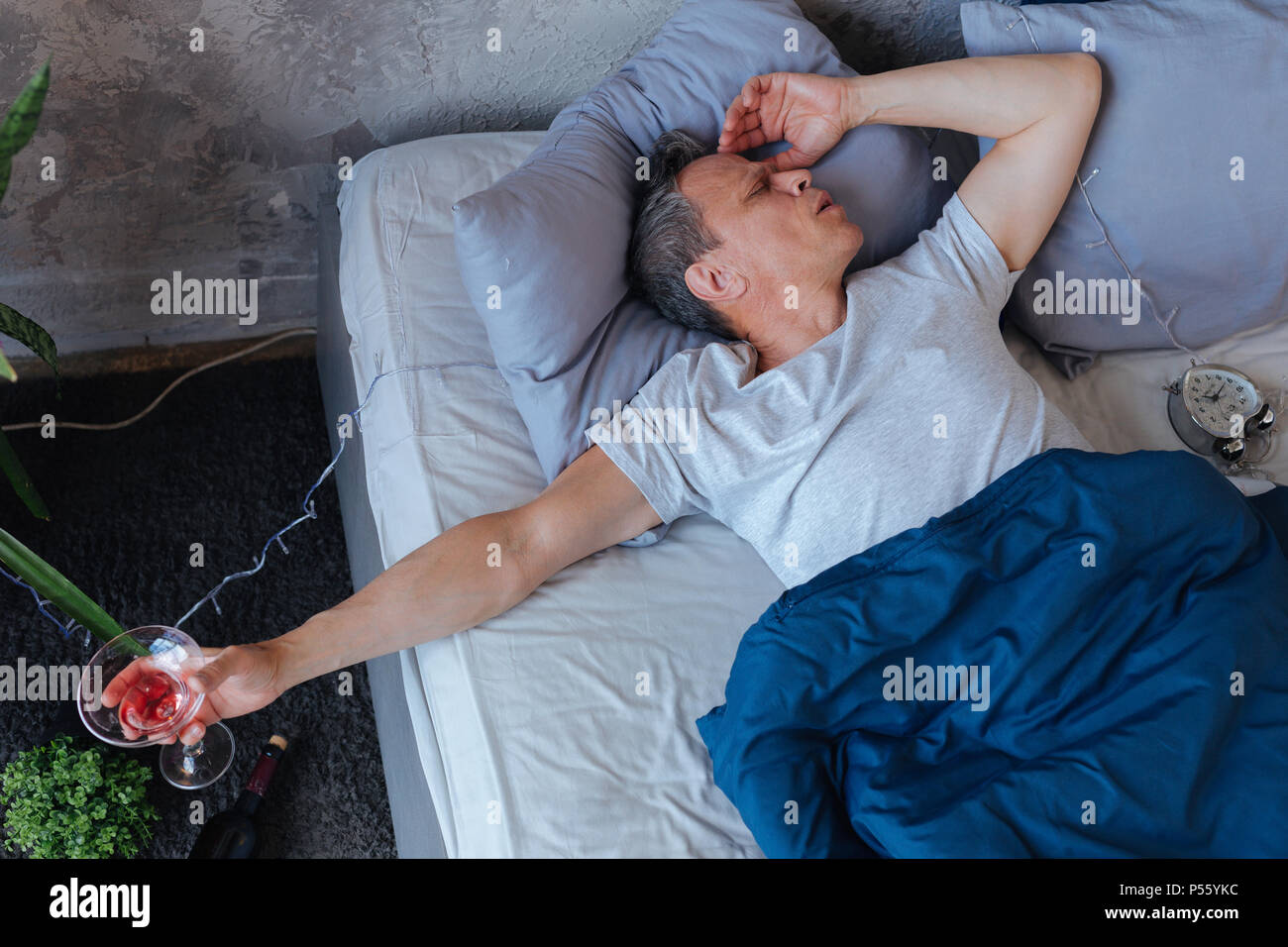 Tired mature man napping after party Stock Photo - Alamy
